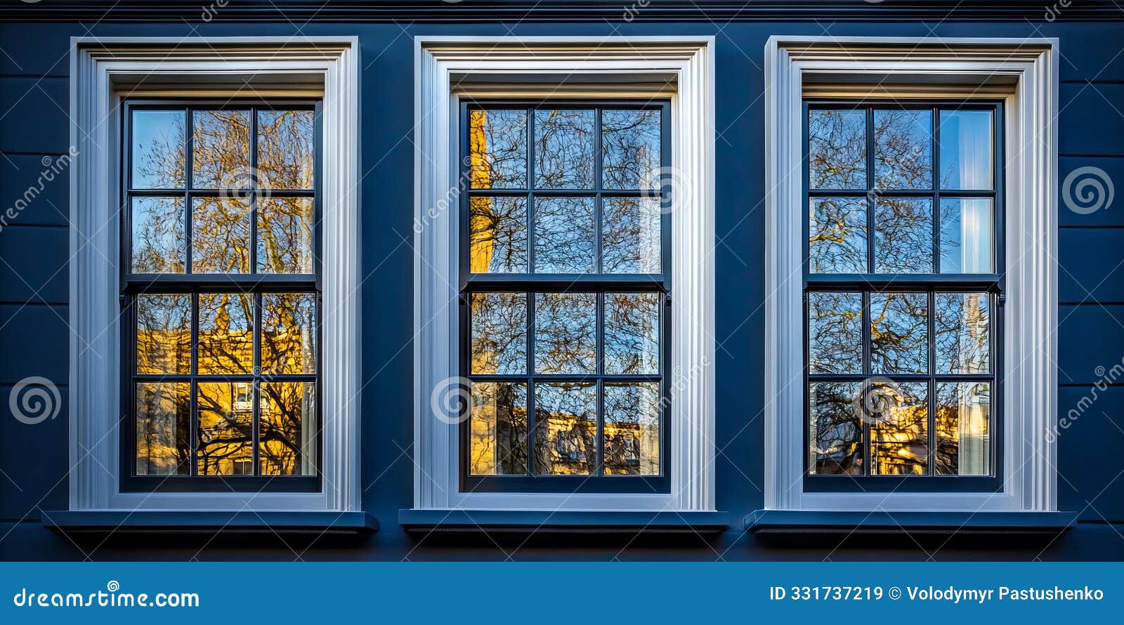 Three Windows on a Blue House with a Reflection of a Tree in the Windows Stock Image - Image of ...