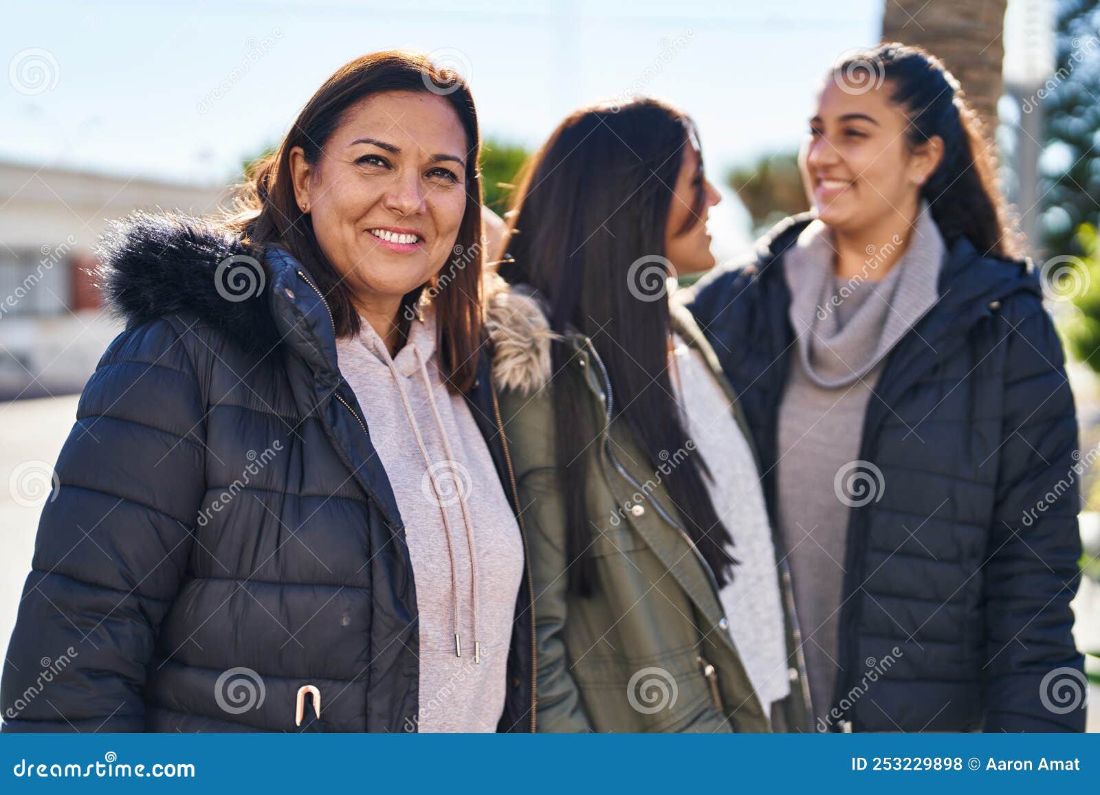 Three Woman Mother And Daughters Standing Together At Street Stock