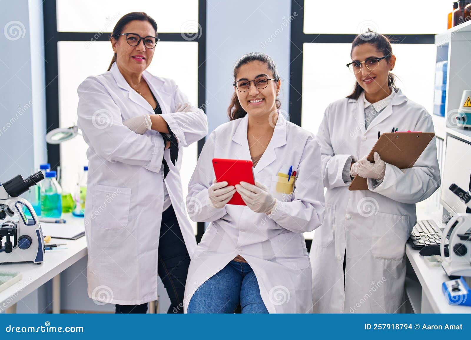 Three Woman Scientists Using Touchpad Write on Checklist at Laboratory ...