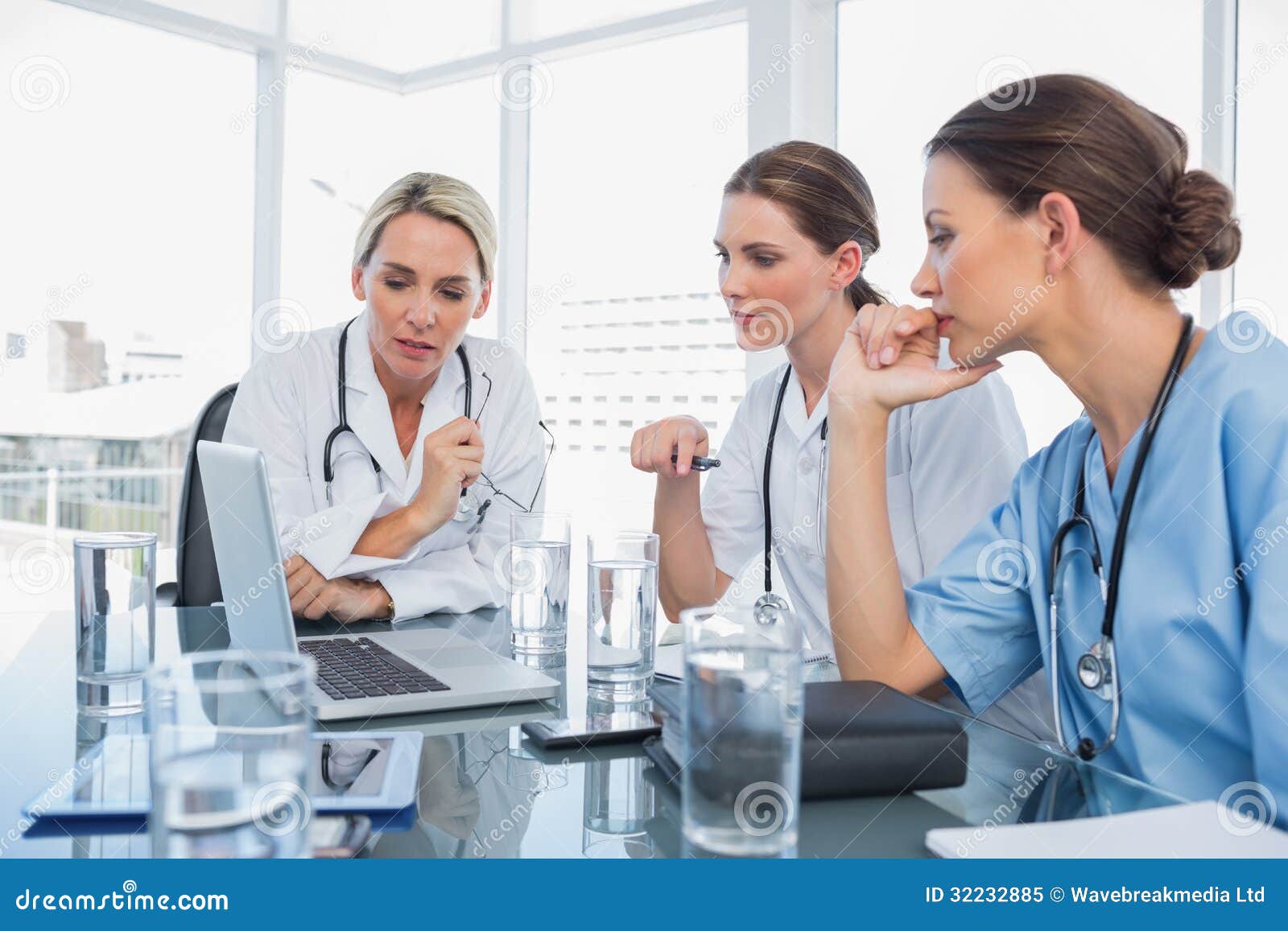 Three Women Doctors Watching a Laptop Stock Image - Image of meeting ...