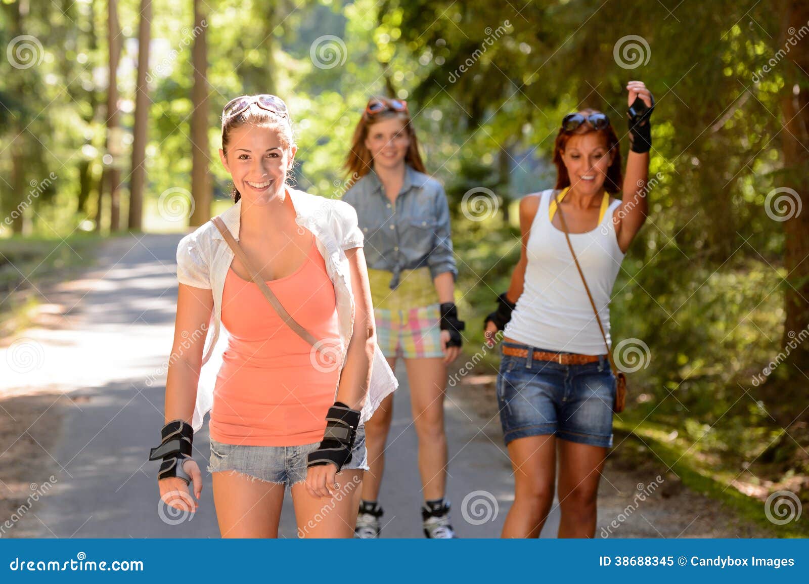 Three Women Friends Roller Skating Outdoors Stock Image - Image of ...