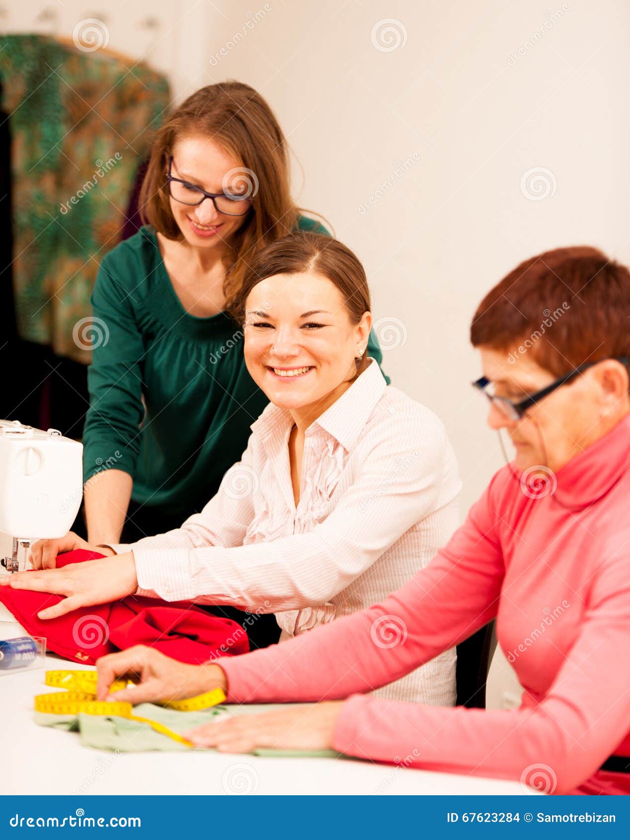 Three Women are Sewing on Handcraft Workshop. they are Teaching Stock ...