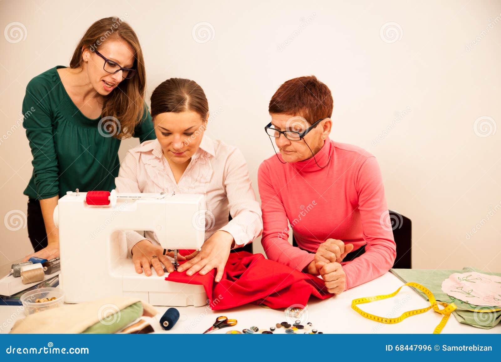 Three Women are Sewing on Handcraft Workshop. they are Teaching Stock ...