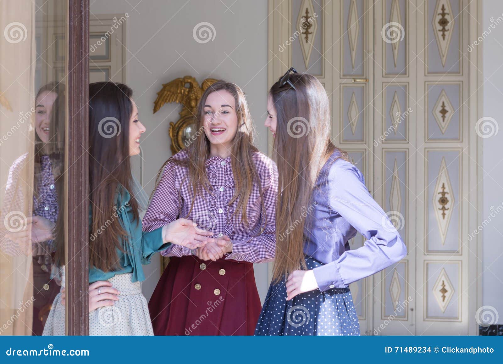 Three Women Smiling while Talking Stock Photo - Image of background ...