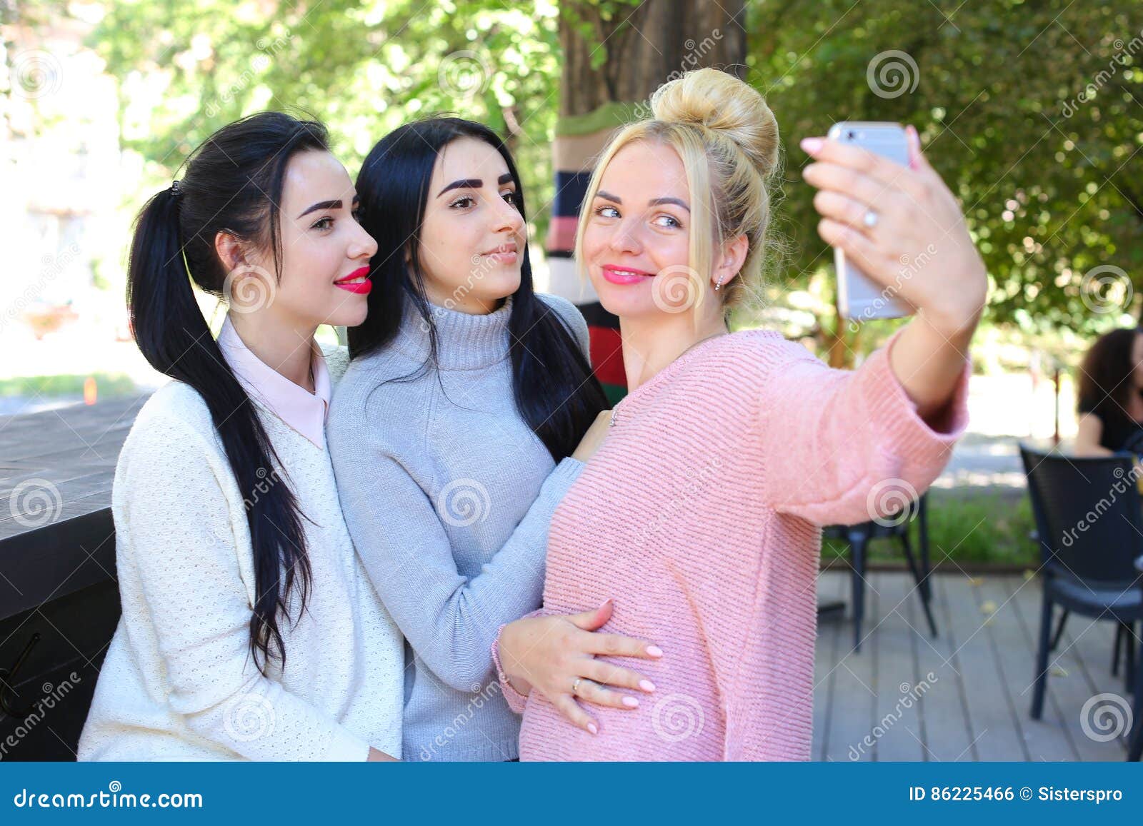Three Wonderful Young Girl Girlfriends Make Selfie Photo On Pho Stock