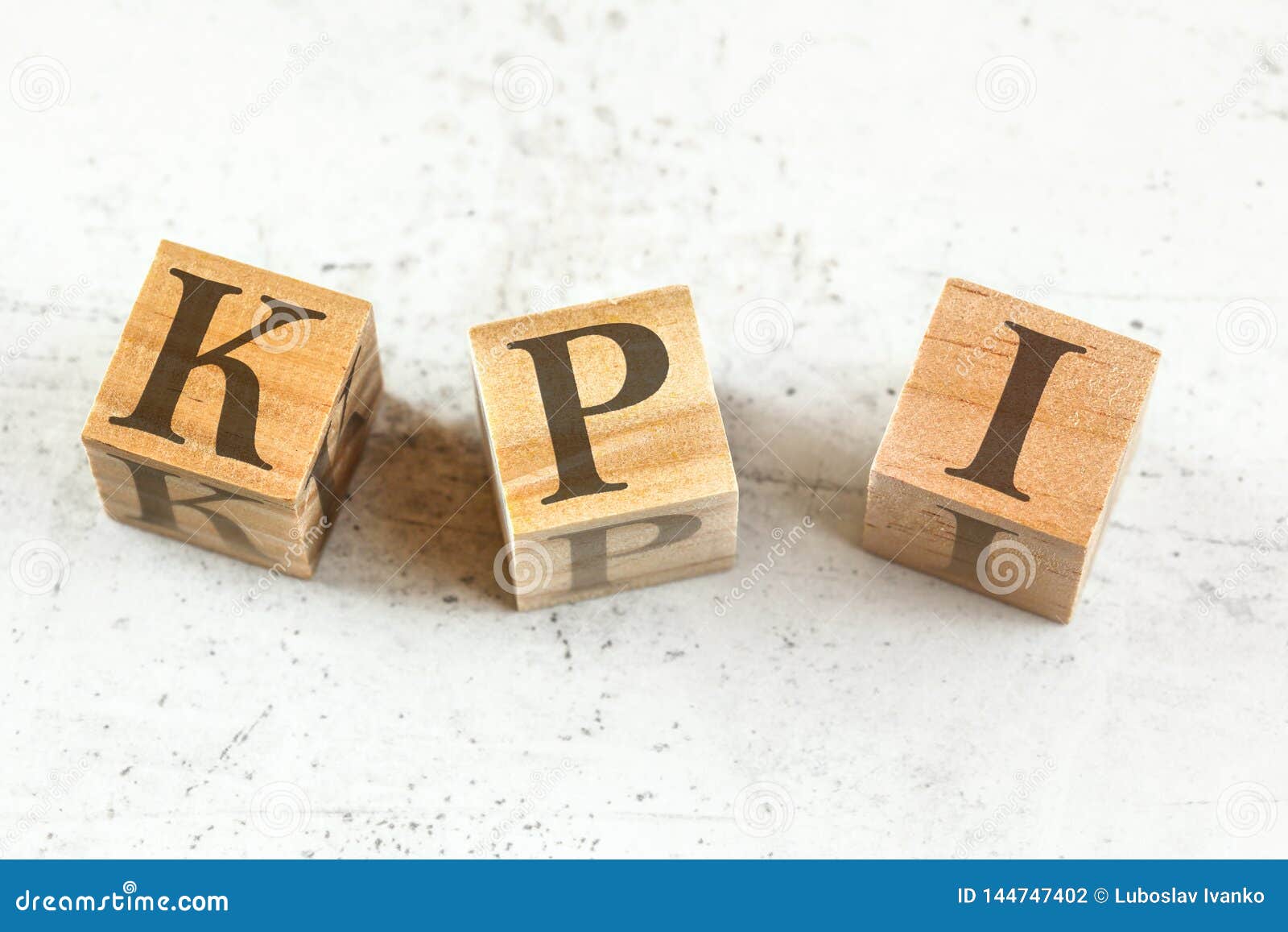 Three Wooden Cubes with Letters KPI Stands for Key Performance ...