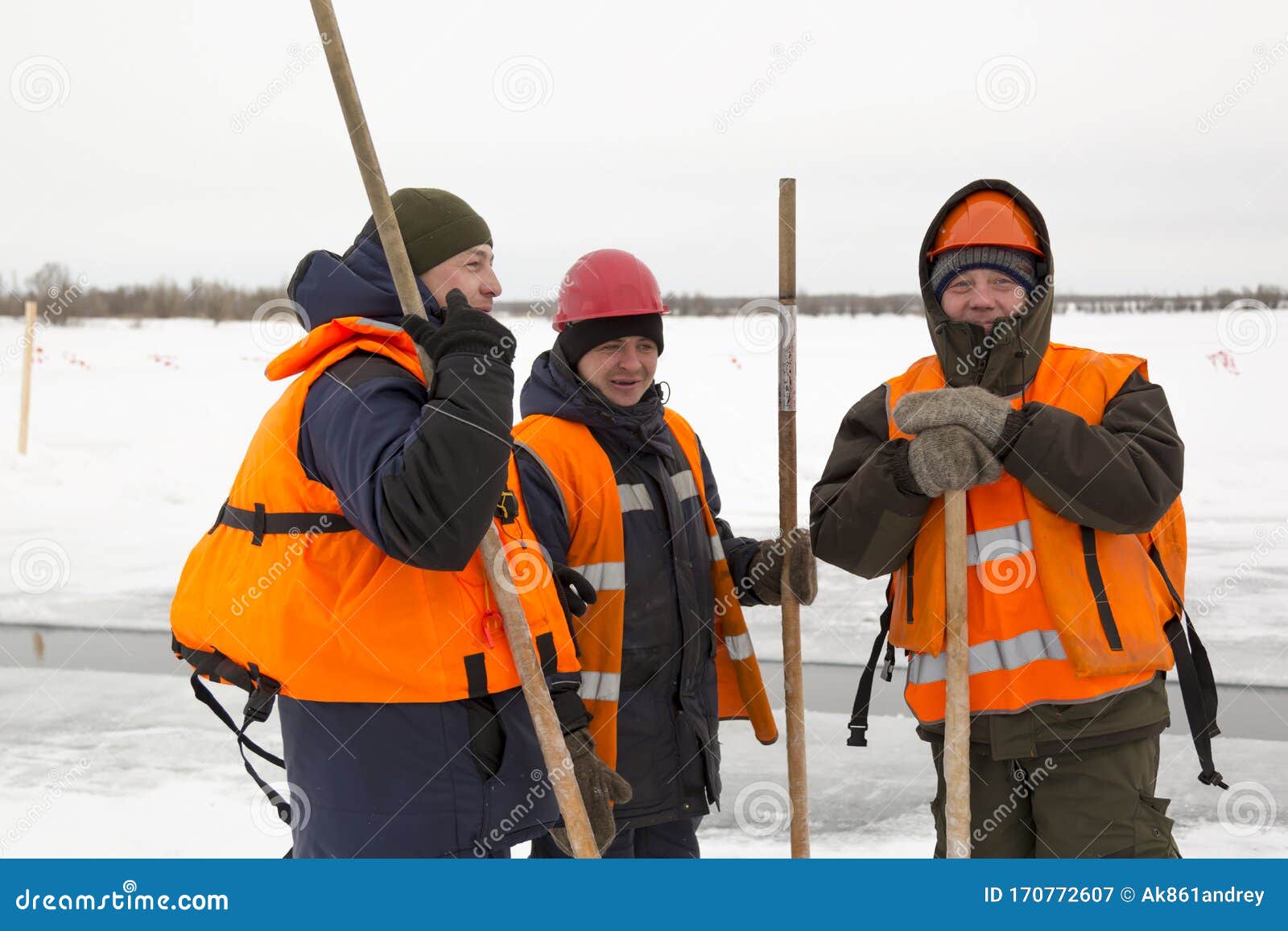 Three Workers on the Ice of a Frozen Pond Stock Image - Image of ...