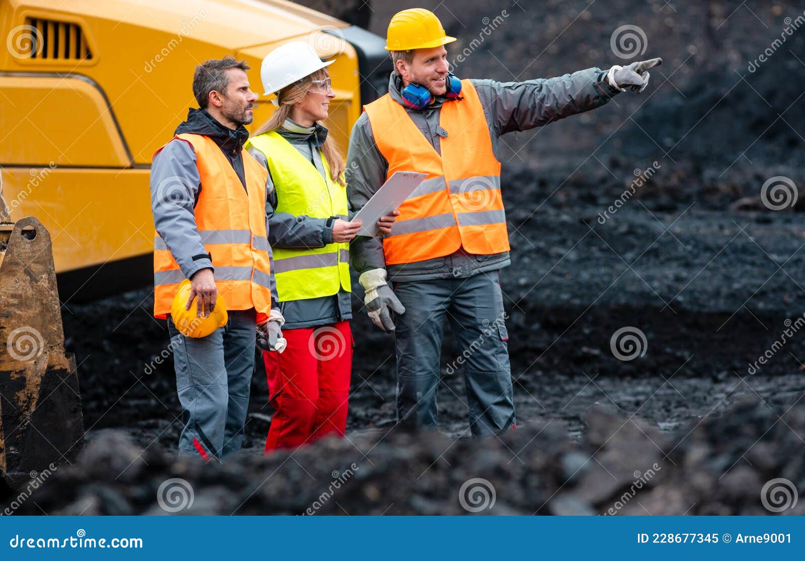 Three Workers in Quarry with Heavy Machinery Stock Image - Image of ...