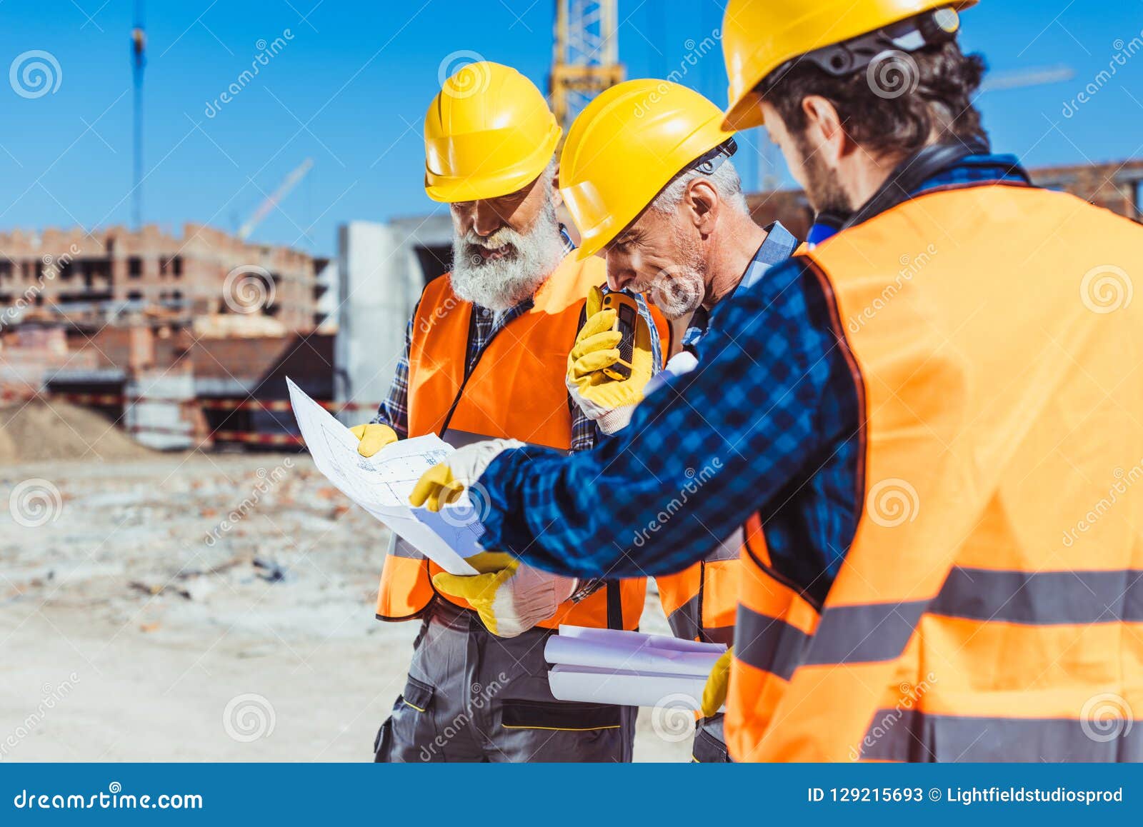 Construction Workers Discussing Building Plans Stock Image - Image of ...