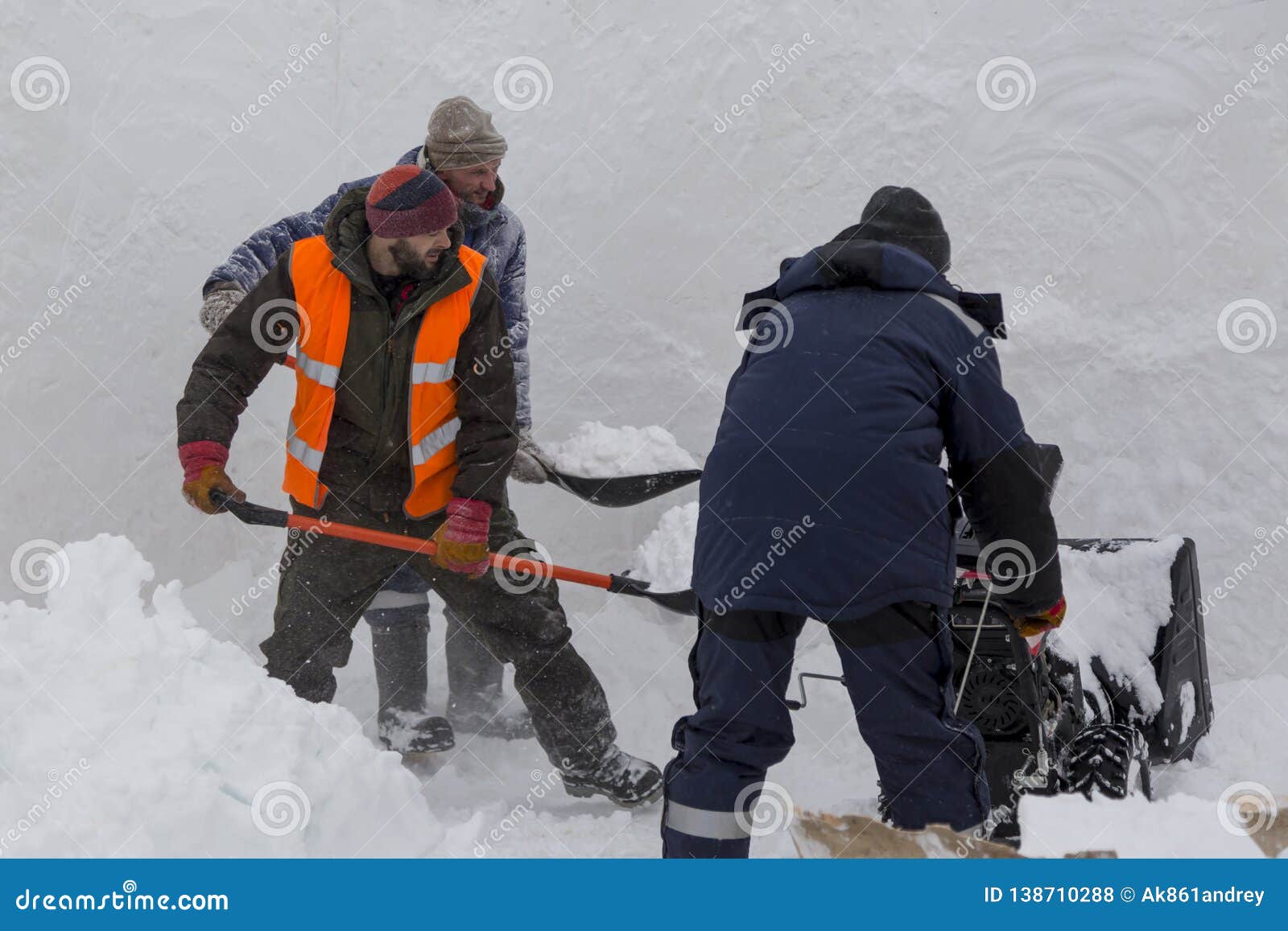 Three Workers in a Snowstorm during Snow Removal Stock Photo - Image of ...