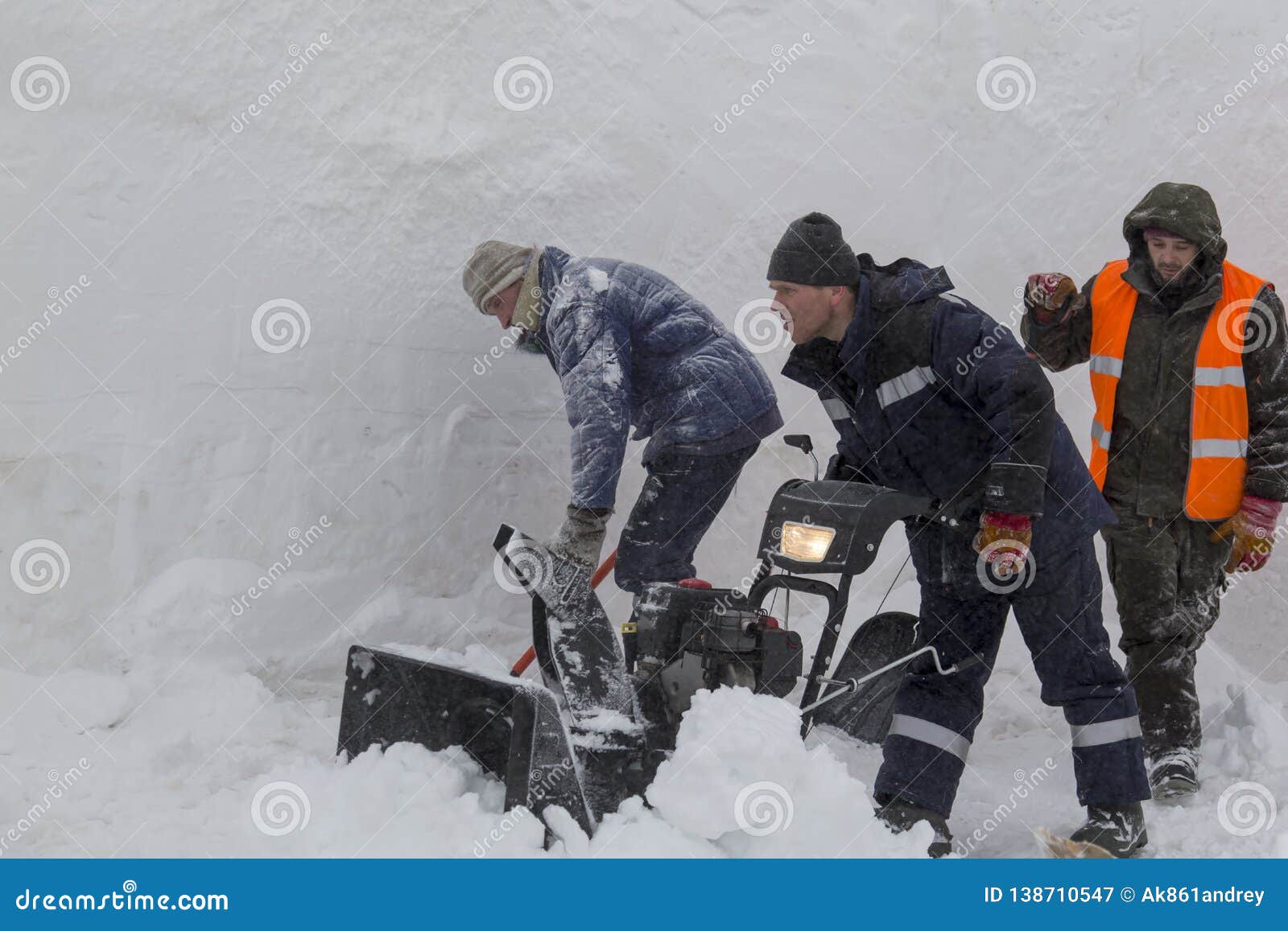 Three Workers in a Snowstorm during Snow Removal Stock Image - Image of ...
