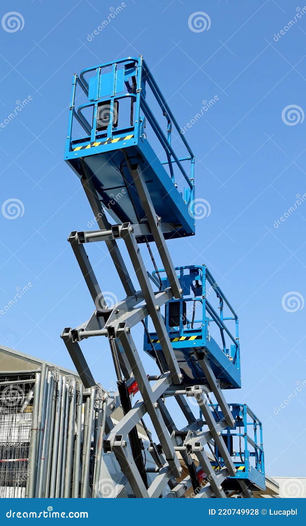 Three Working Platforms, Called Scissor Elevator, Against Blue Sky ...