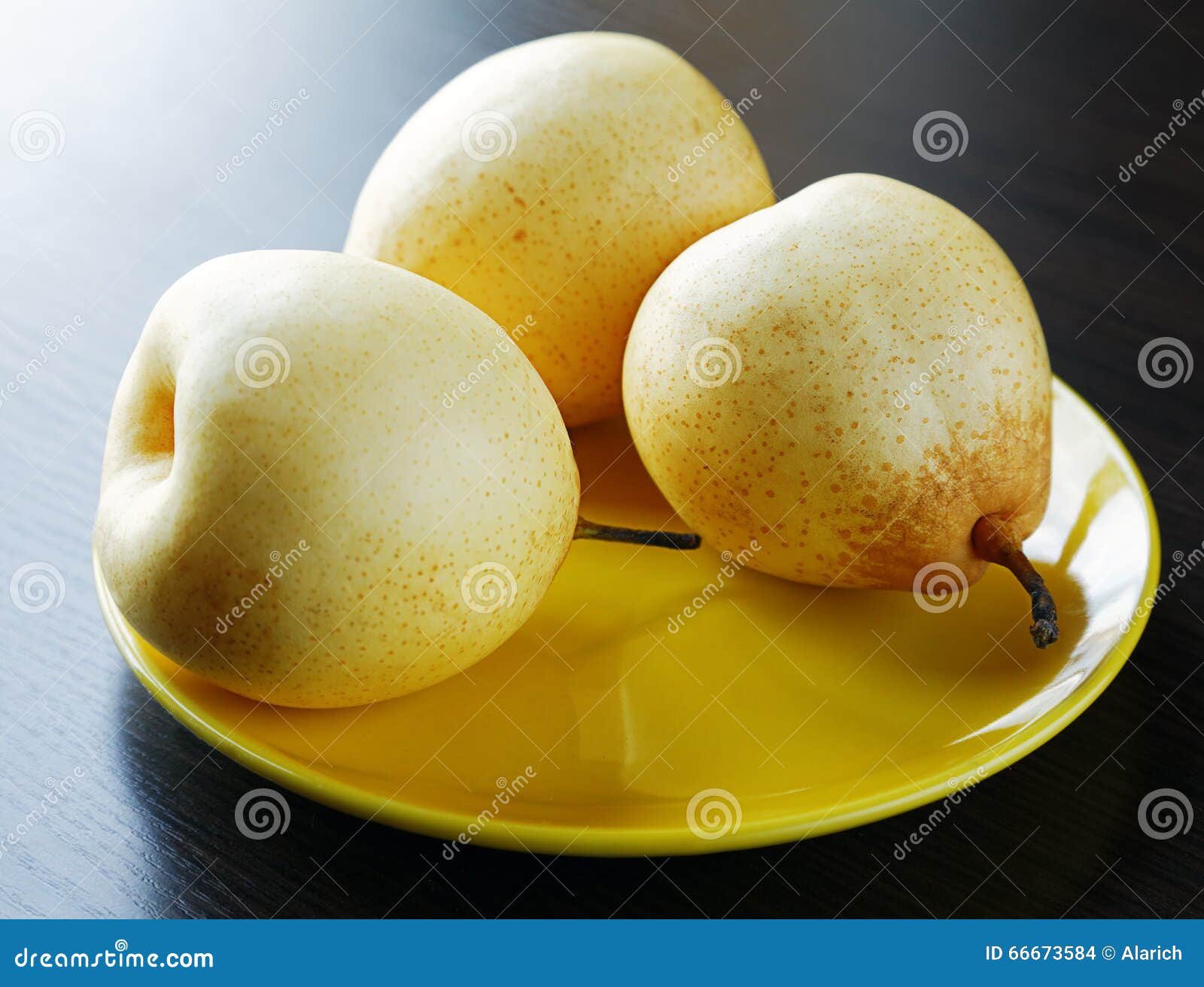 Three Yellow Pears on the Plate Stock Photo - Image of plate, season ...