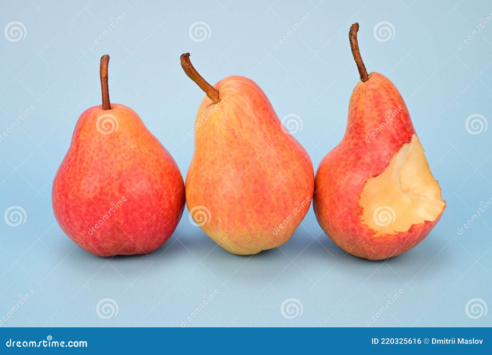 Three Yellow-red Pears are Lined Up Side by Side. One Pear Has Been ...