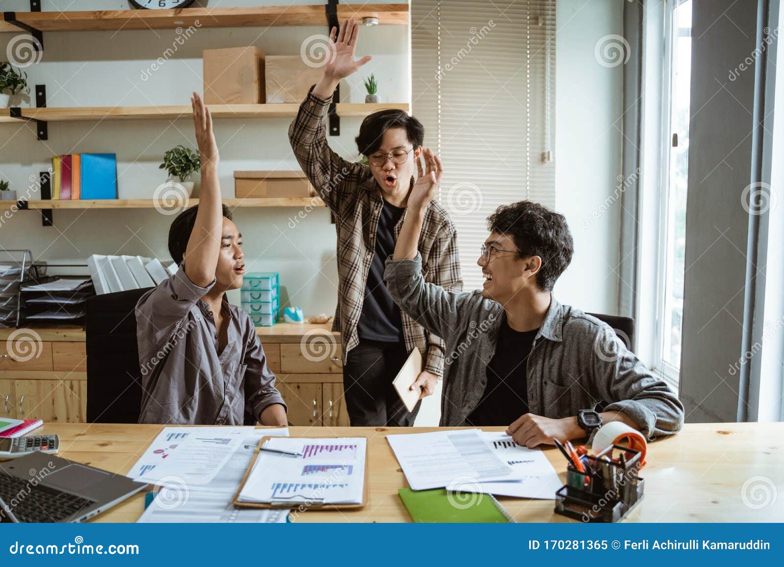 Three Young Asian Workers Work Together in Agreement at Planning Stock ...