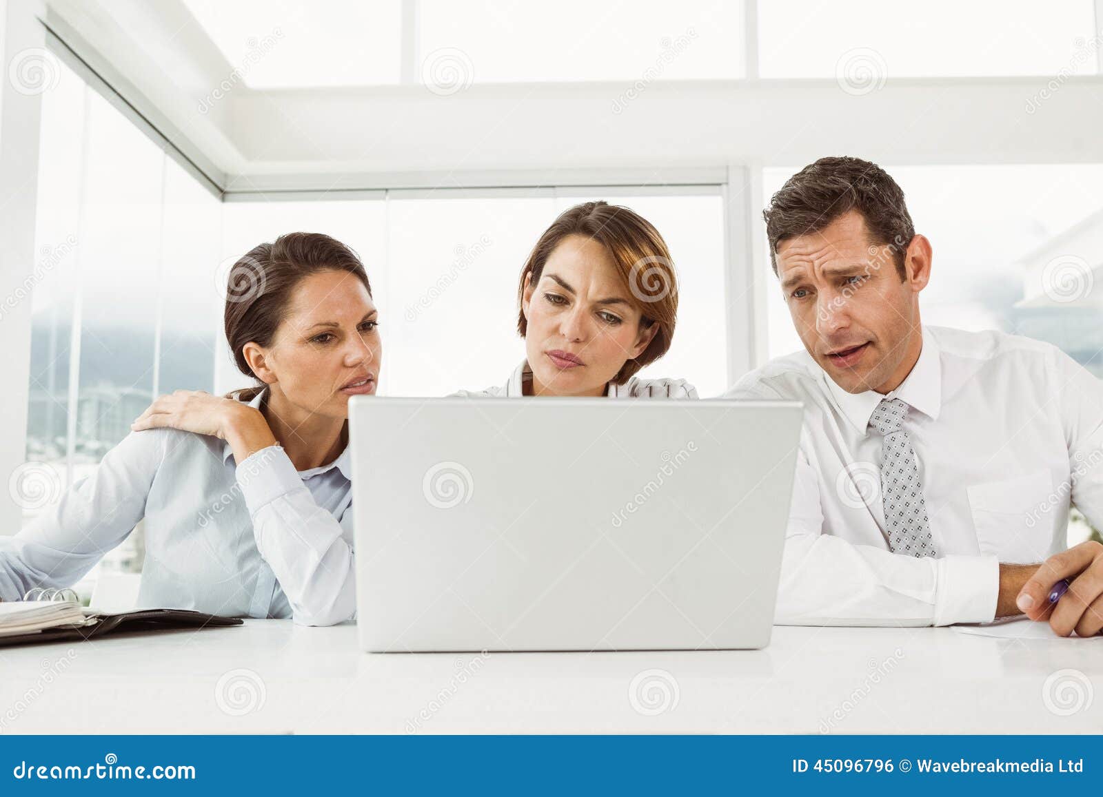 Three Young Business People Using Laptop Stock Photo - Image of ...