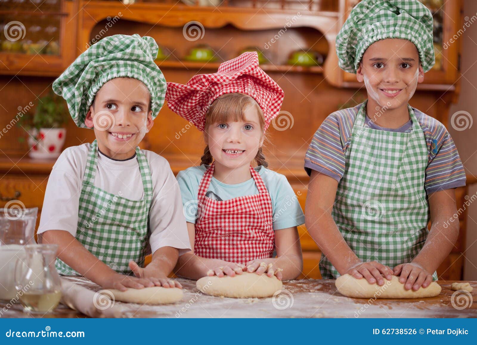 Three Young Children Make a Mess in the Kitchen Stock Photo - Image of ...