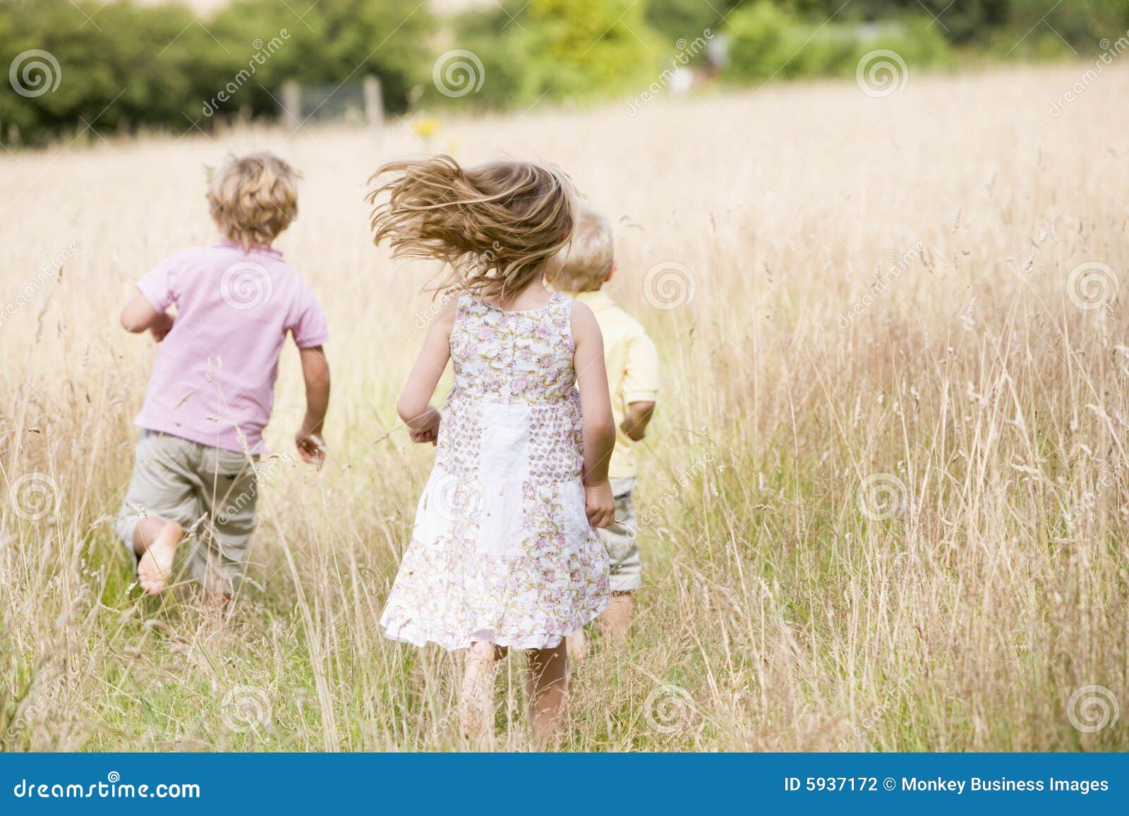 Three Young Children Running Outdoors Stock Photo - Image of ...