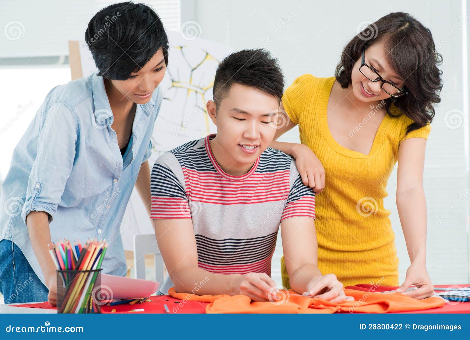 Three young designers stock photo. Image of draft, designer - 28800422