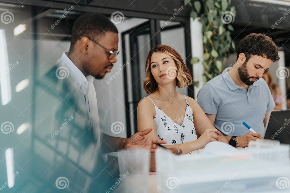 Three Young Entrepreneurs Discussing Possible Solution for the Upcoming ...