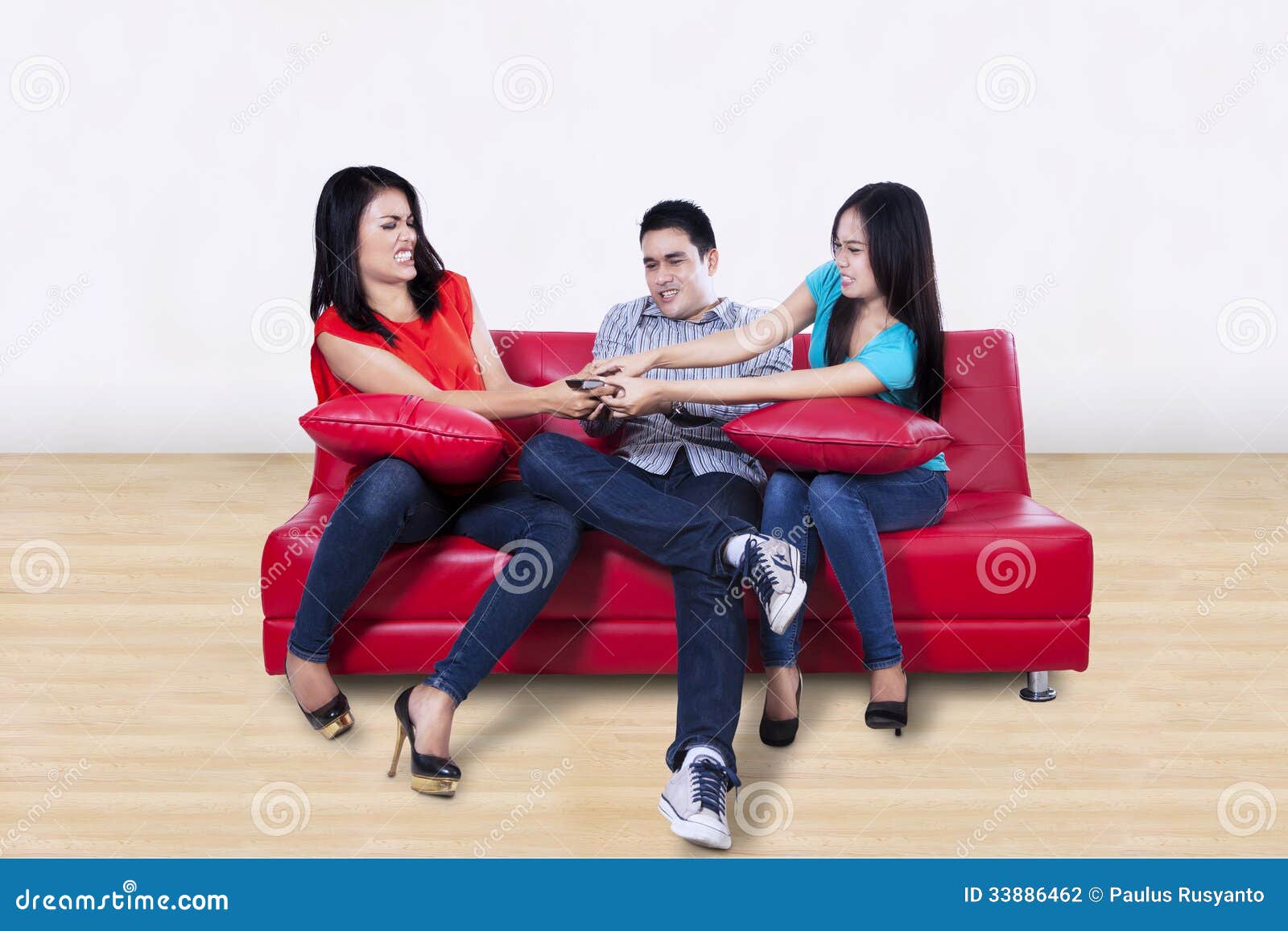 Three Young Friends Fighting for a Remote Stock Photo - Image of indian ...