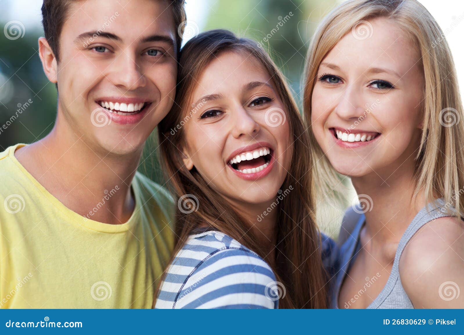Three Young Friends Smiling Stock Image - Image of outdoors, teenagers ...