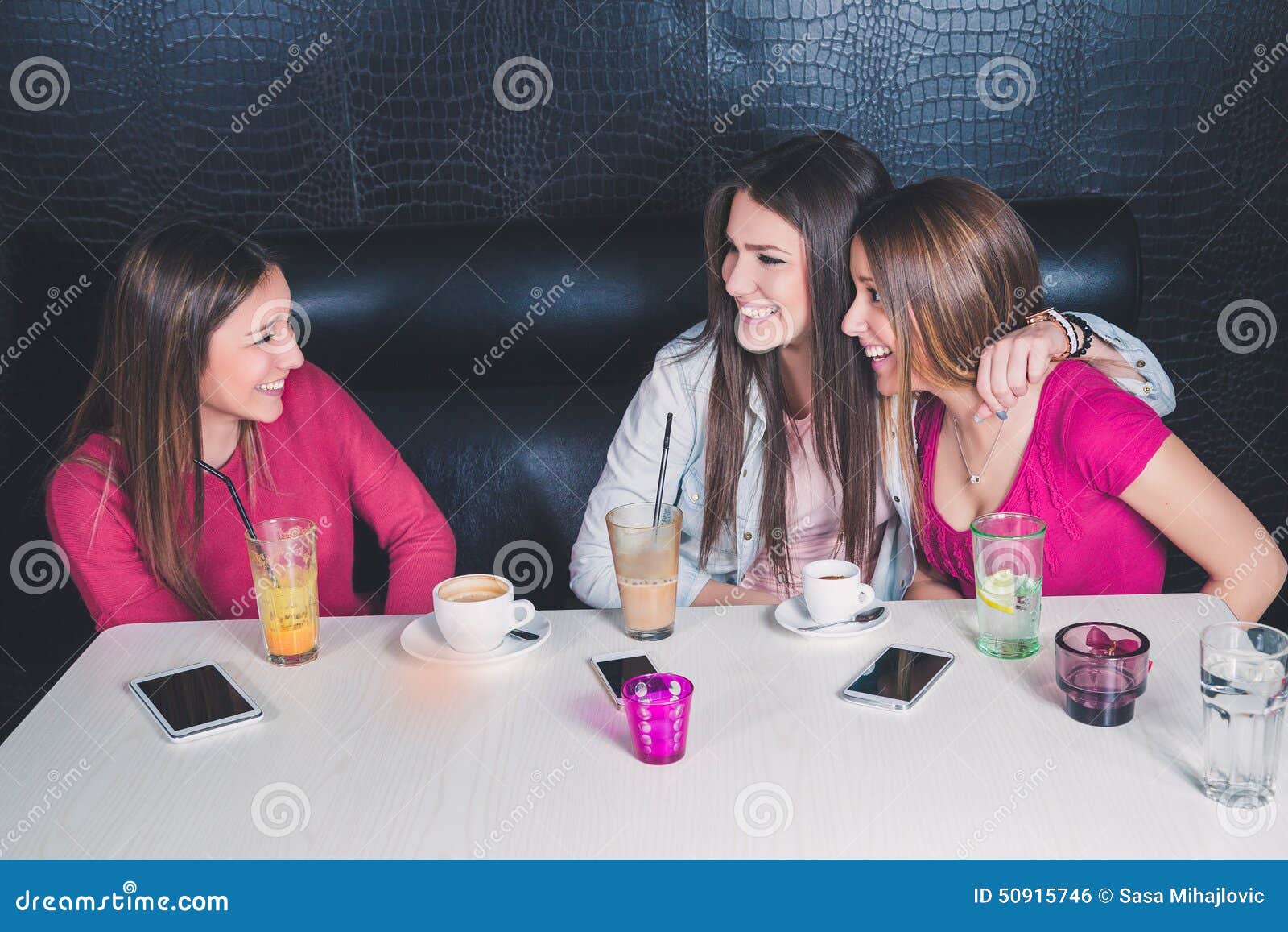 Three Young Girls Having Fun in a Cafe Stock Photo - Image of mobile ...