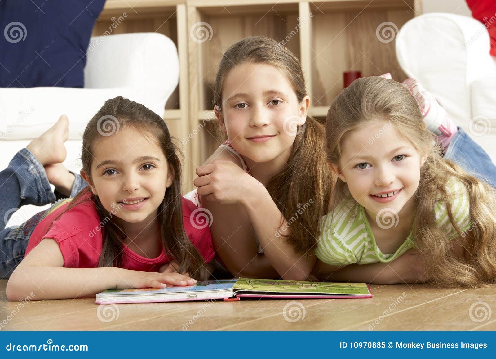 Three Young Girls Reading Book at Home Stock Image - Image of eight ...