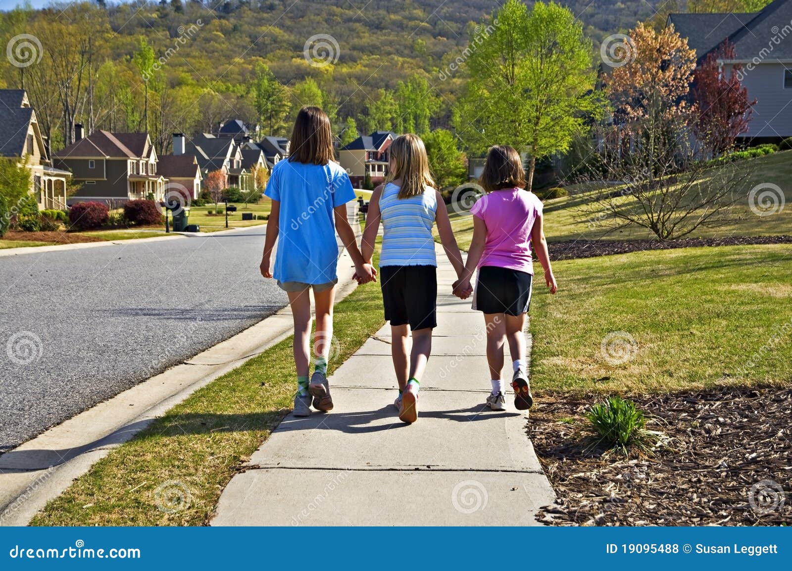 Three Young Girls Walking stock photo. Image of road - 19095488