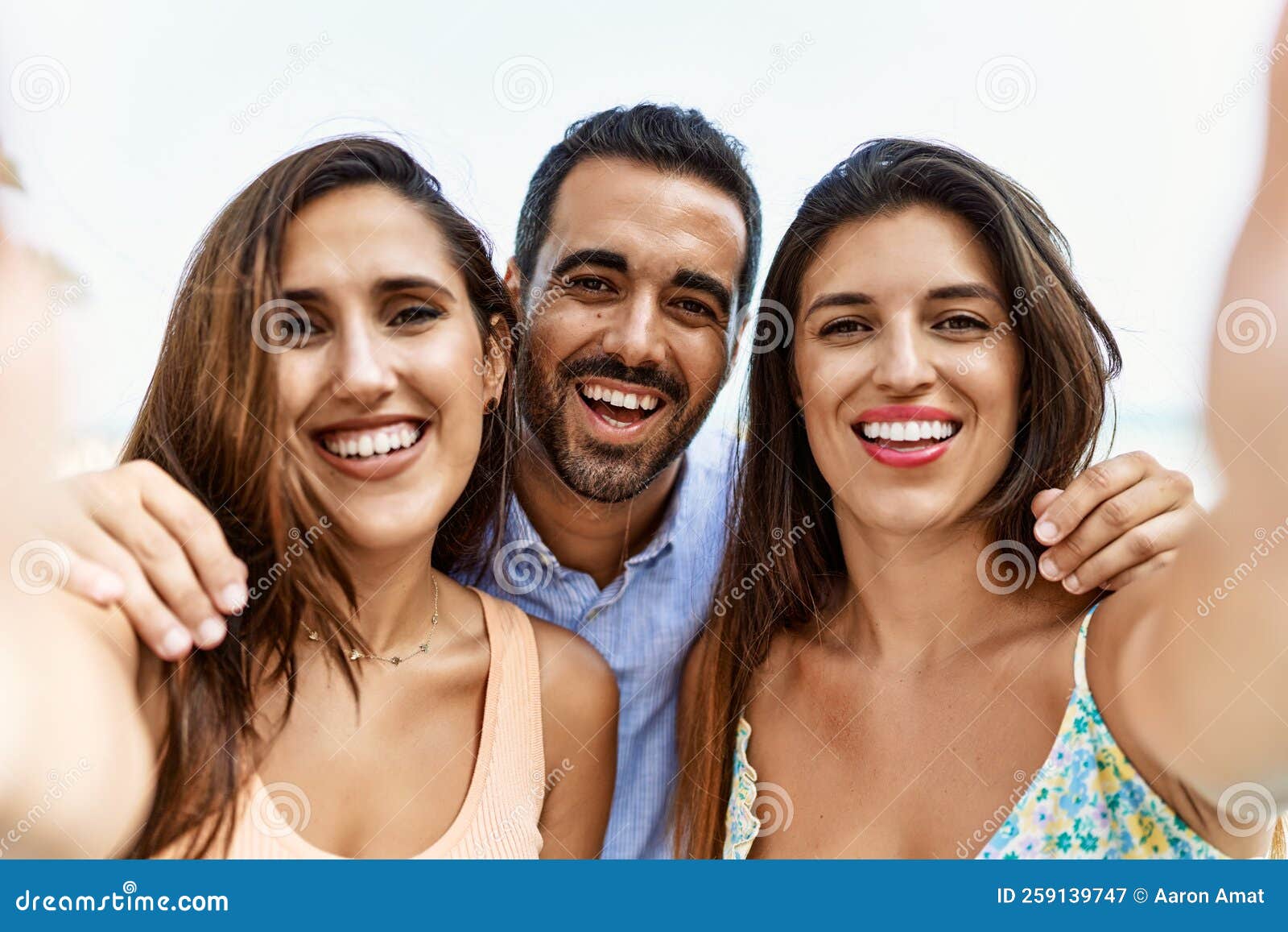 Three Young Hispanic Friends Smiling Happy and Hugging Make Selfie by ...