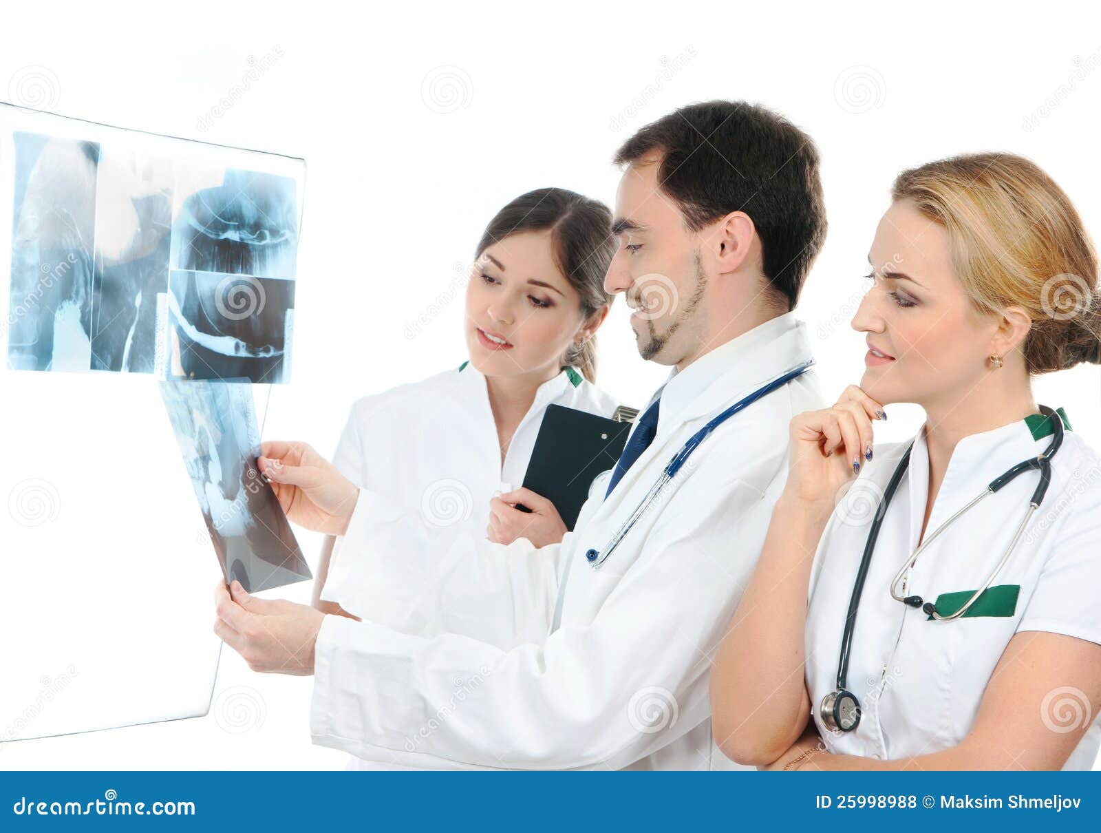 Three Young Medical Workers Examining X-rays Stock Photo - Image of ...
