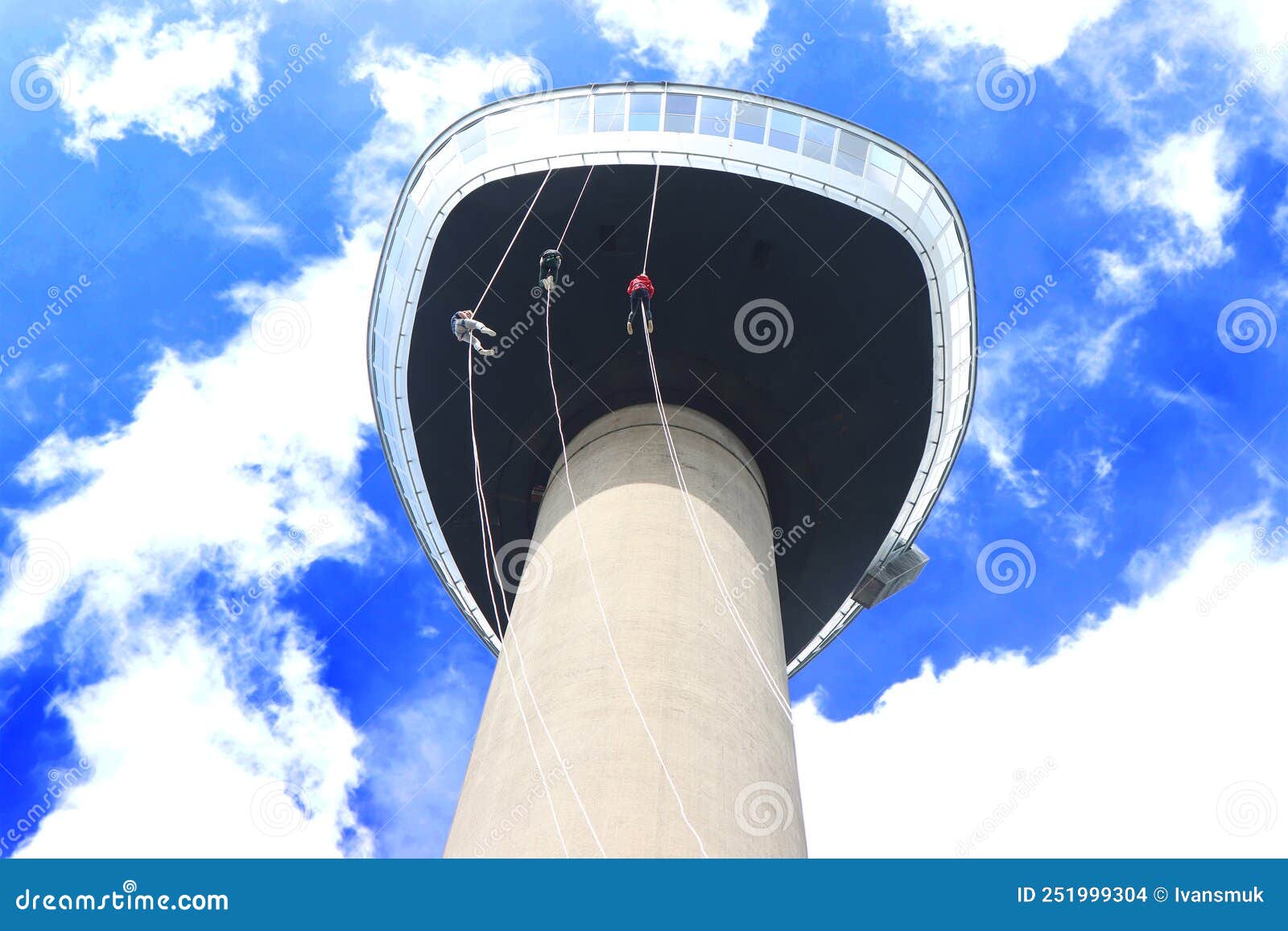 Three Young People Abseiling Down the Euromast Tower in Rotterdam Stock ...