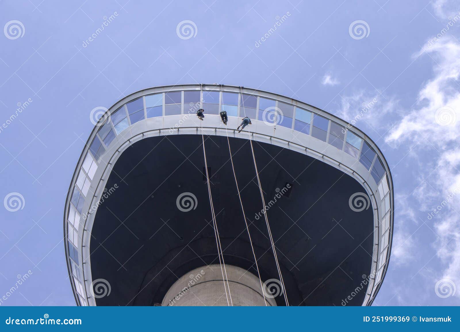 Three Young People Abseiling Down the Euromast Tower in Rotterdam Stock ...