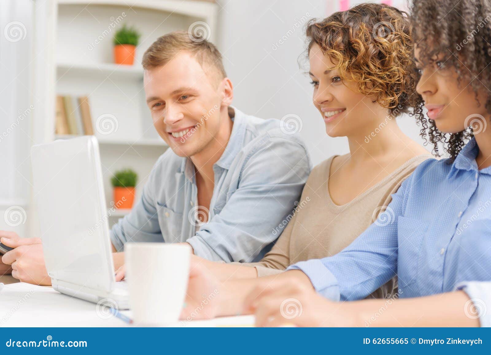 Three Young People are Collaborating in the Office Stock Image - Image ...