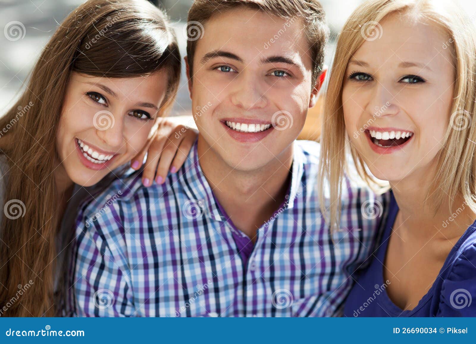 Three young people smiling stock photo. Image of friendship - 26690034