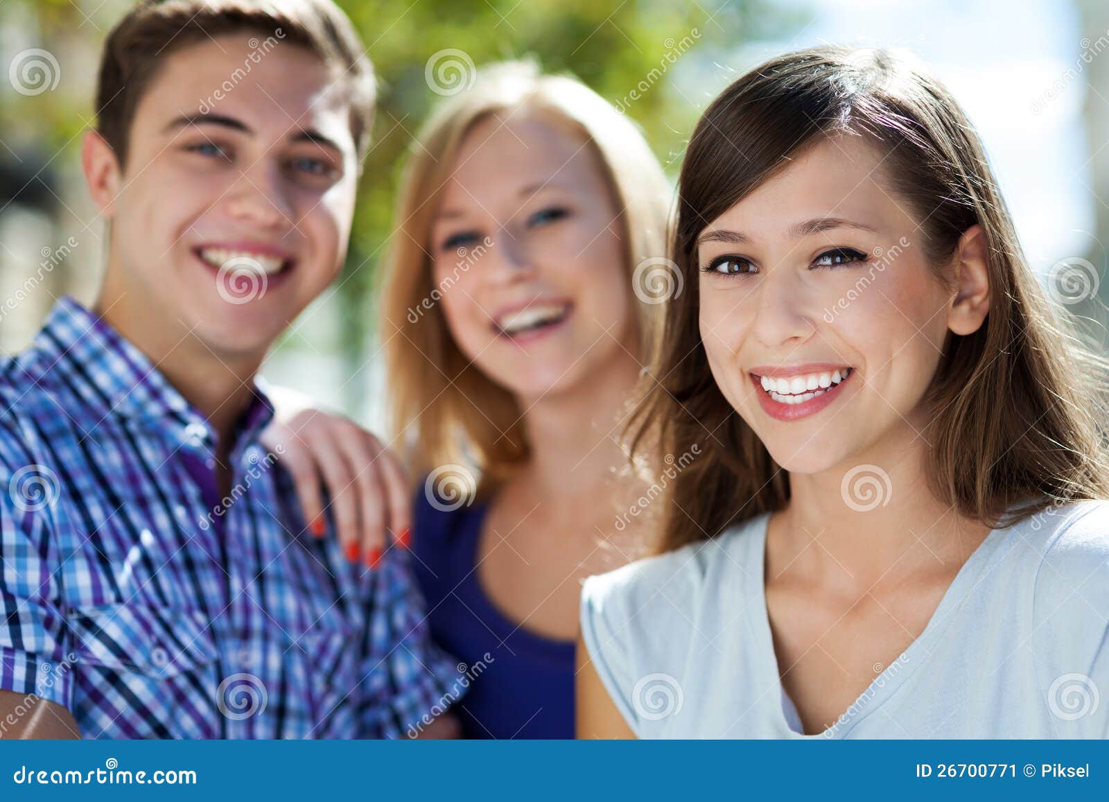 Three young people smiling stock image. Image of girl - 26700771