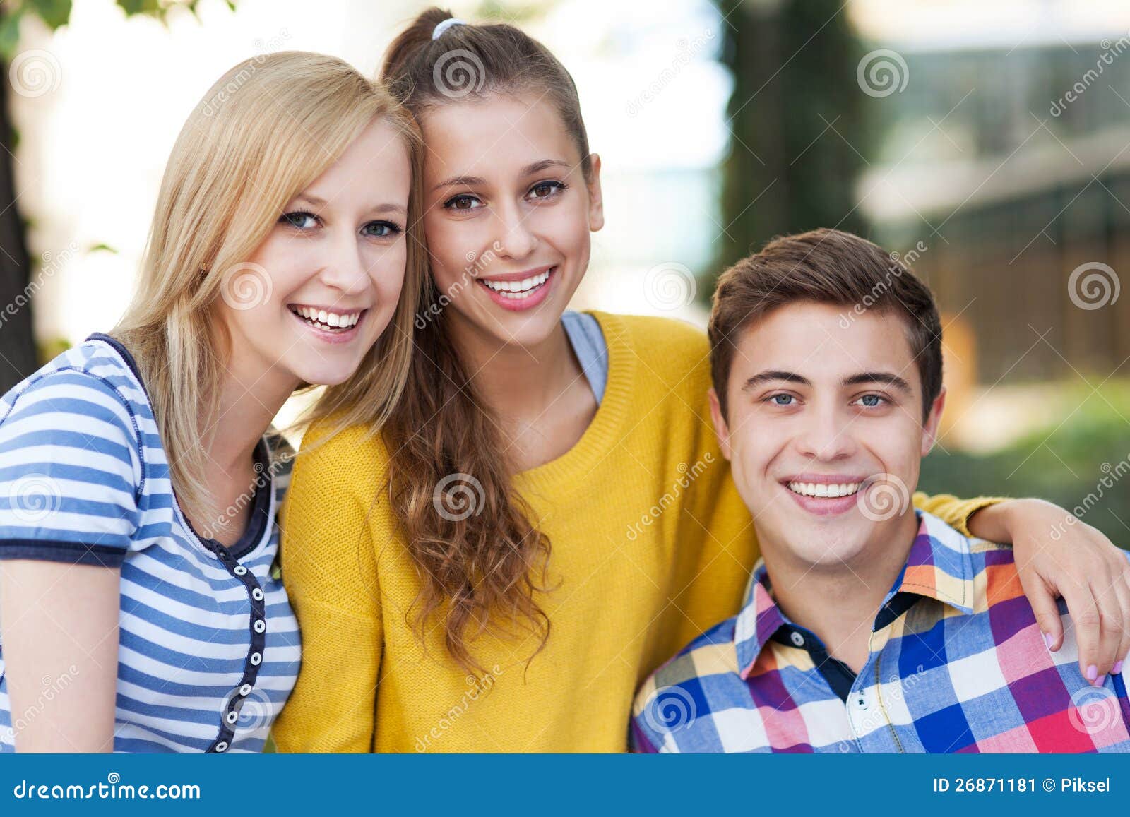 Three young people smiling stock image. Image of friends - 26871181