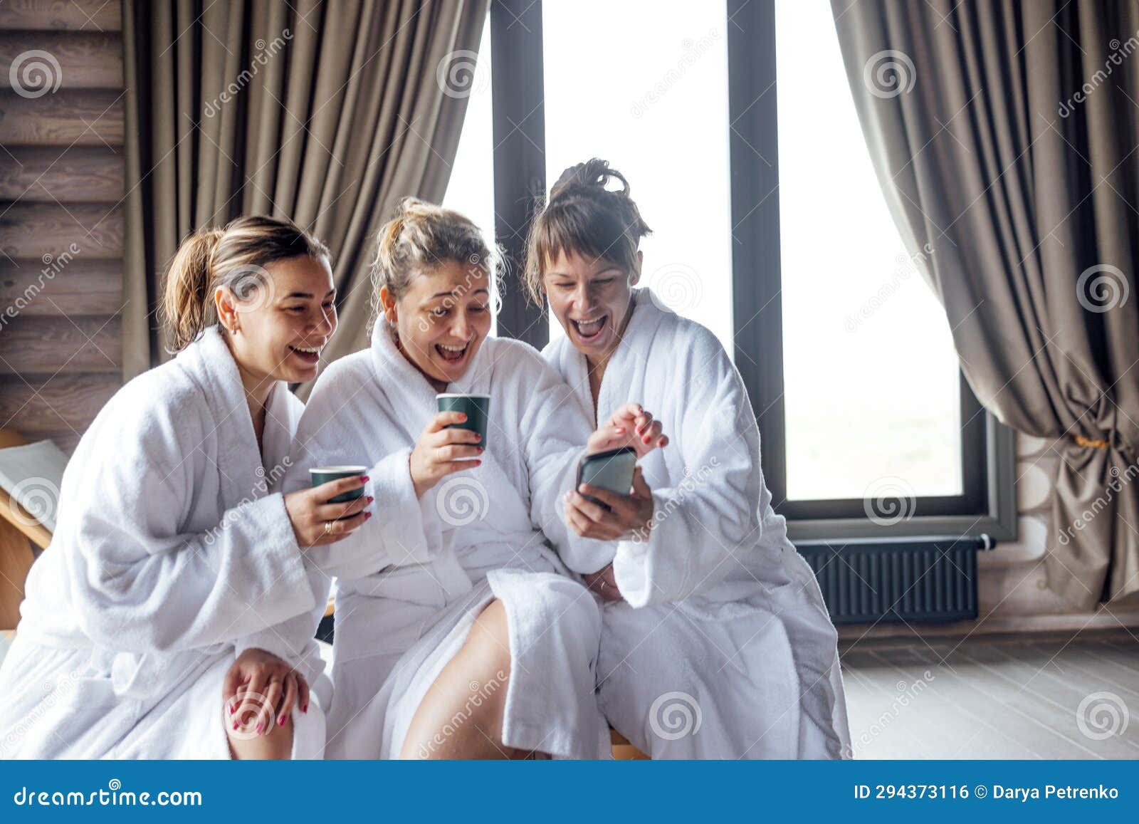 Three Young Smiling Women in White Bath Robes on Spa Procedure Stock ...