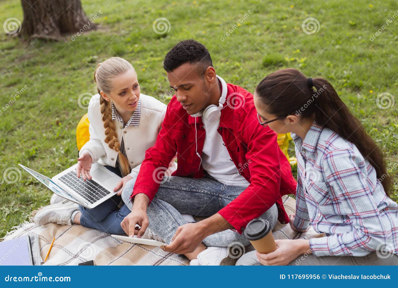 Three Young Students Discussing Their Student Life Stock Photo - Image ...
