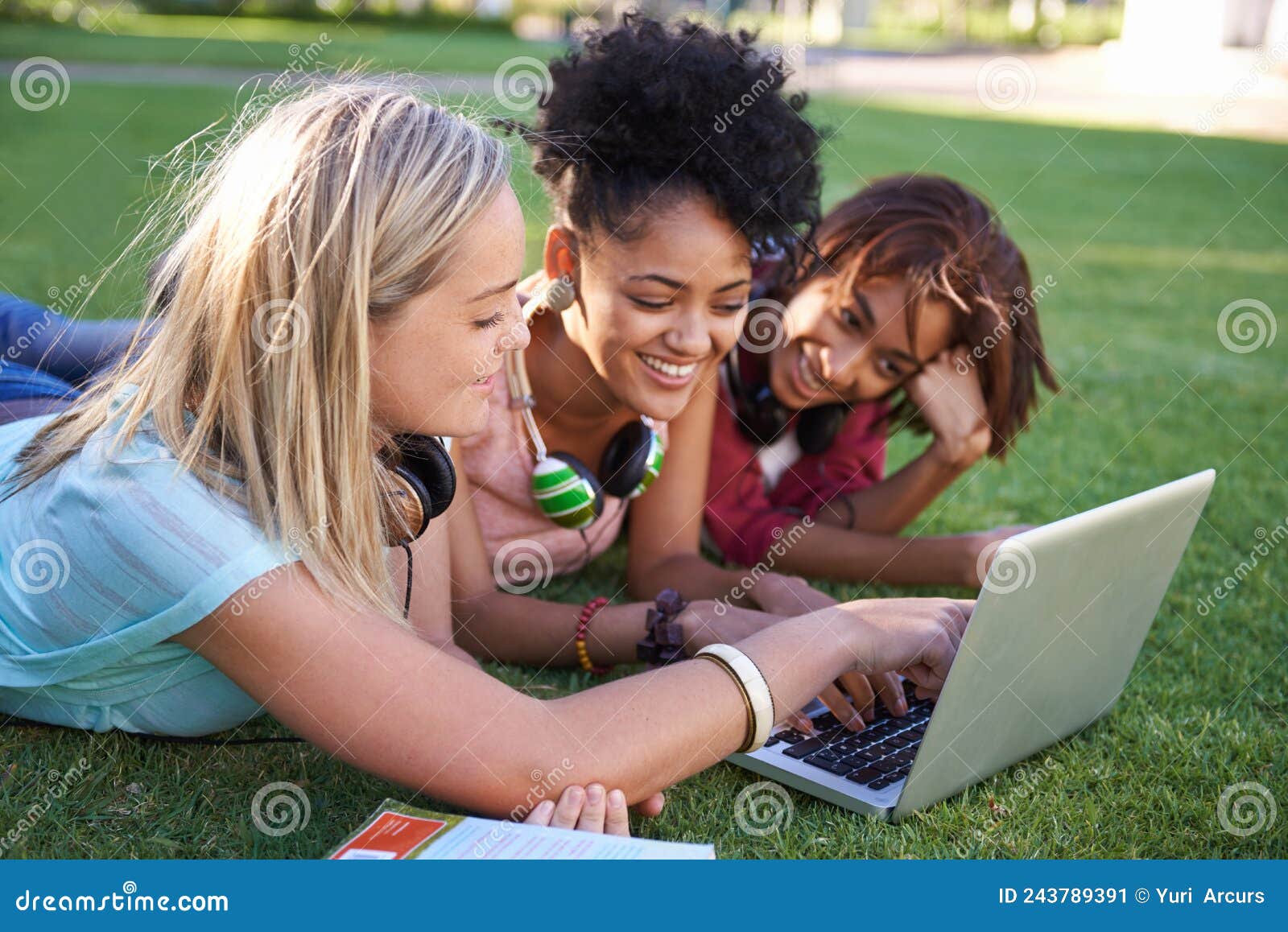 Helping Each Other through a Difficult Assignment. Three Young Students ...