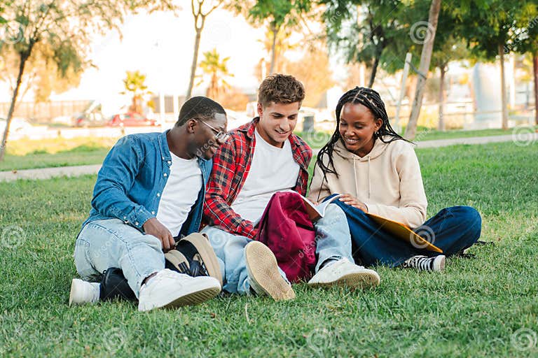 Three Young Students Studying and Doing Homework on a University Campus ...