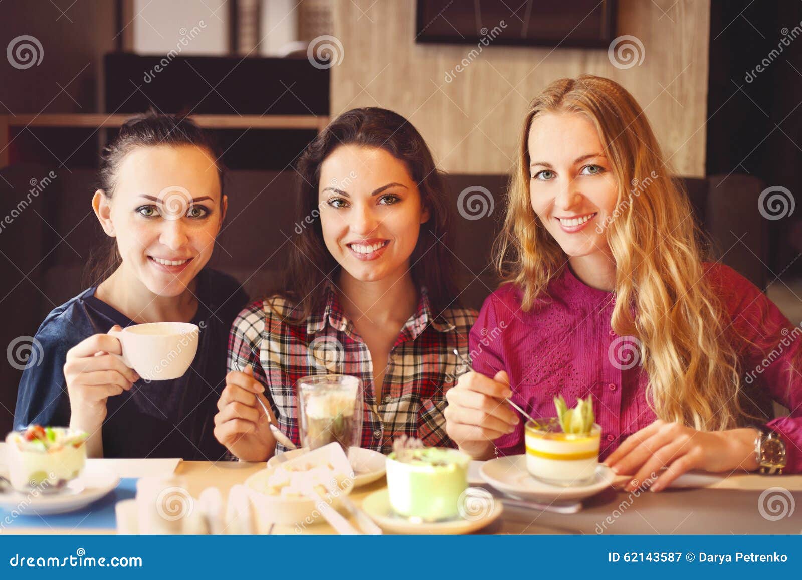 Three Young Women at a Meeting in a Cafe Stock Image - Image of morning ...