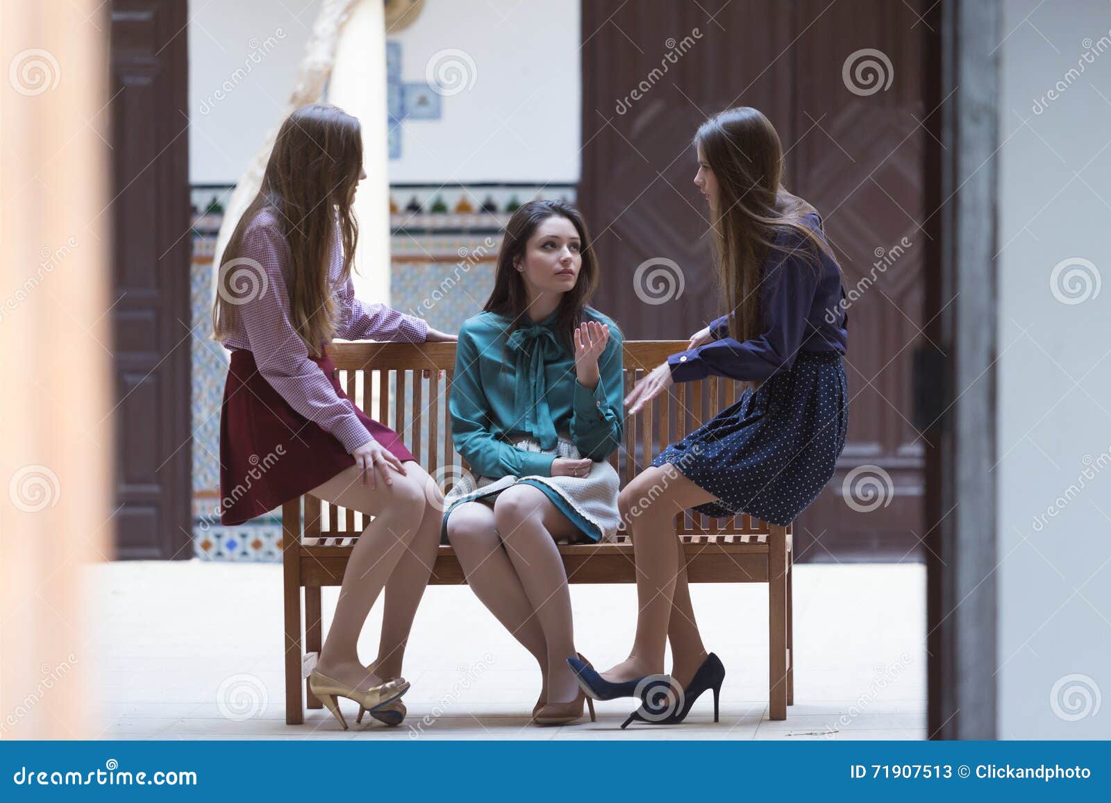 Three Young Women Talking on Bench Stock Image - Image of bench, skirt ...