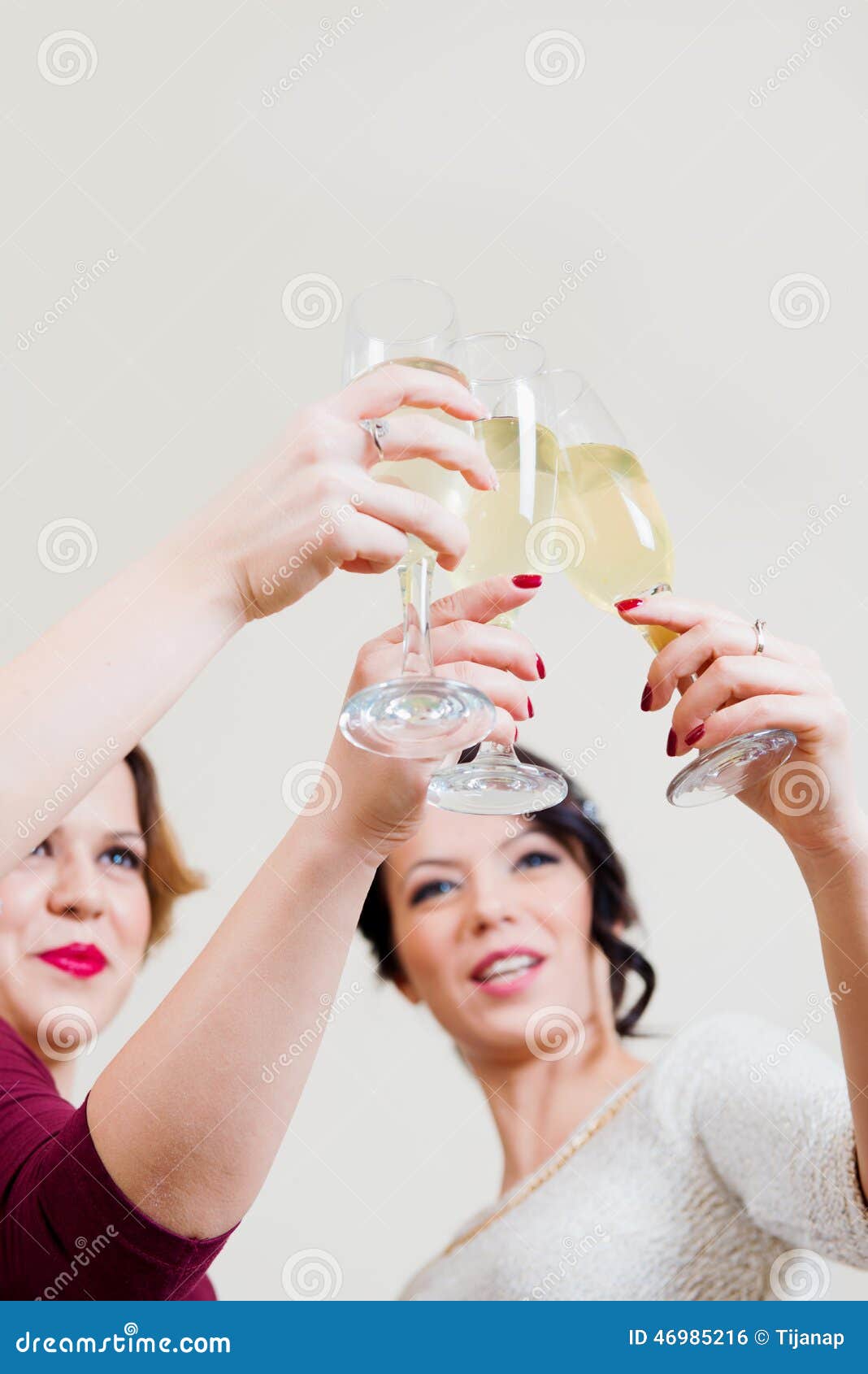 Three Young Women Toasting with Champagne Stock Photo - Image of ...