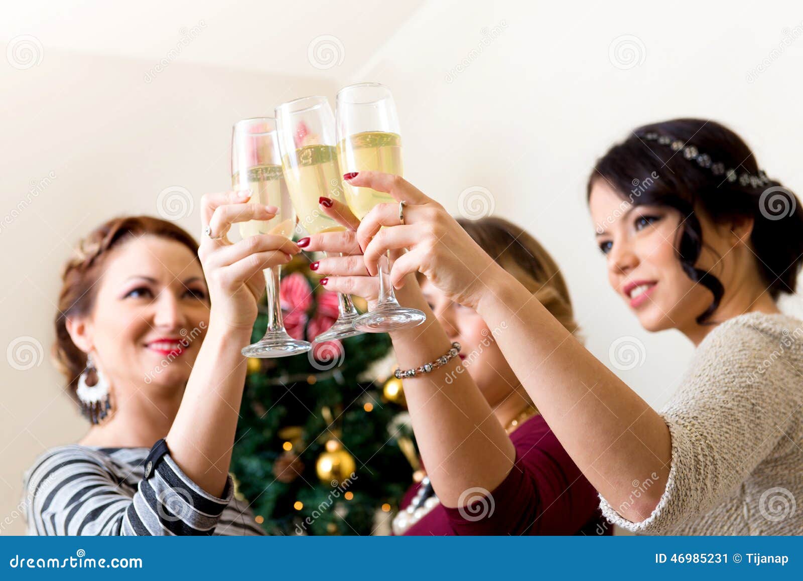 Three Young Women Toasting with Champagne Stock Image - Image of drink ...