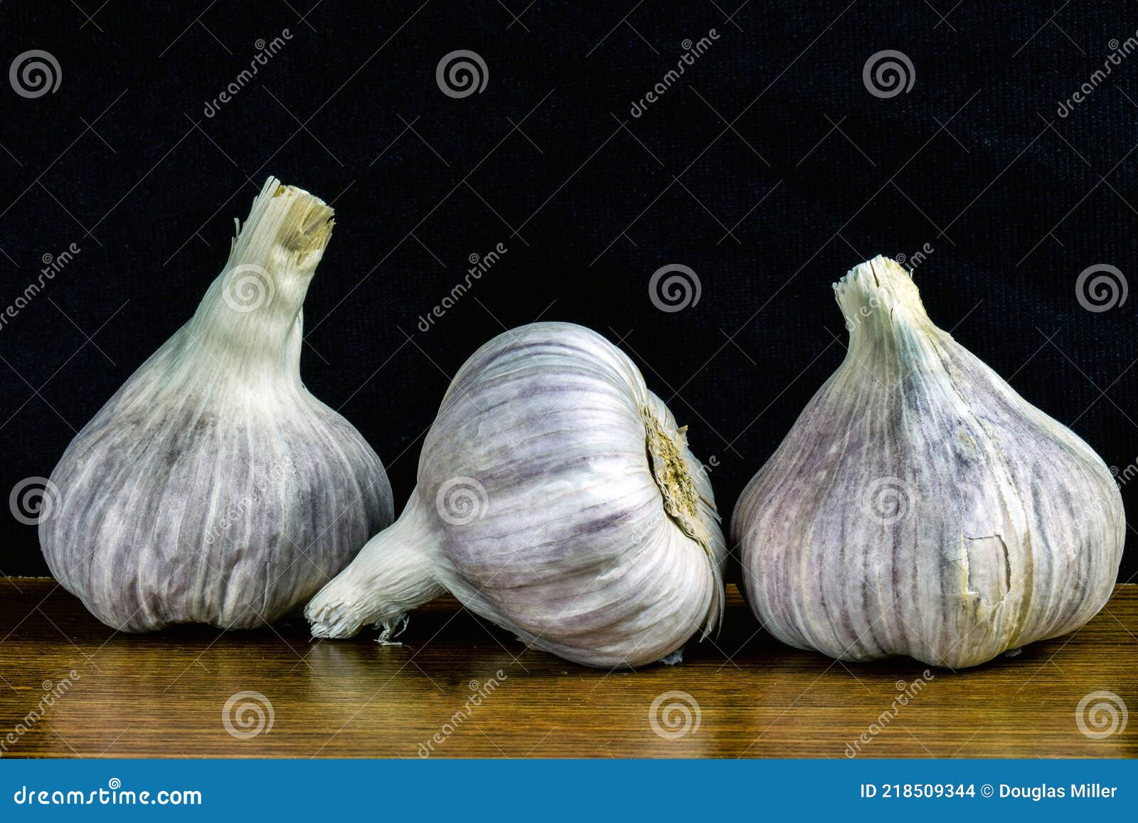 Three Cloves of Garlic on a Table Stock Photo - Image of eating, bulbs ...
