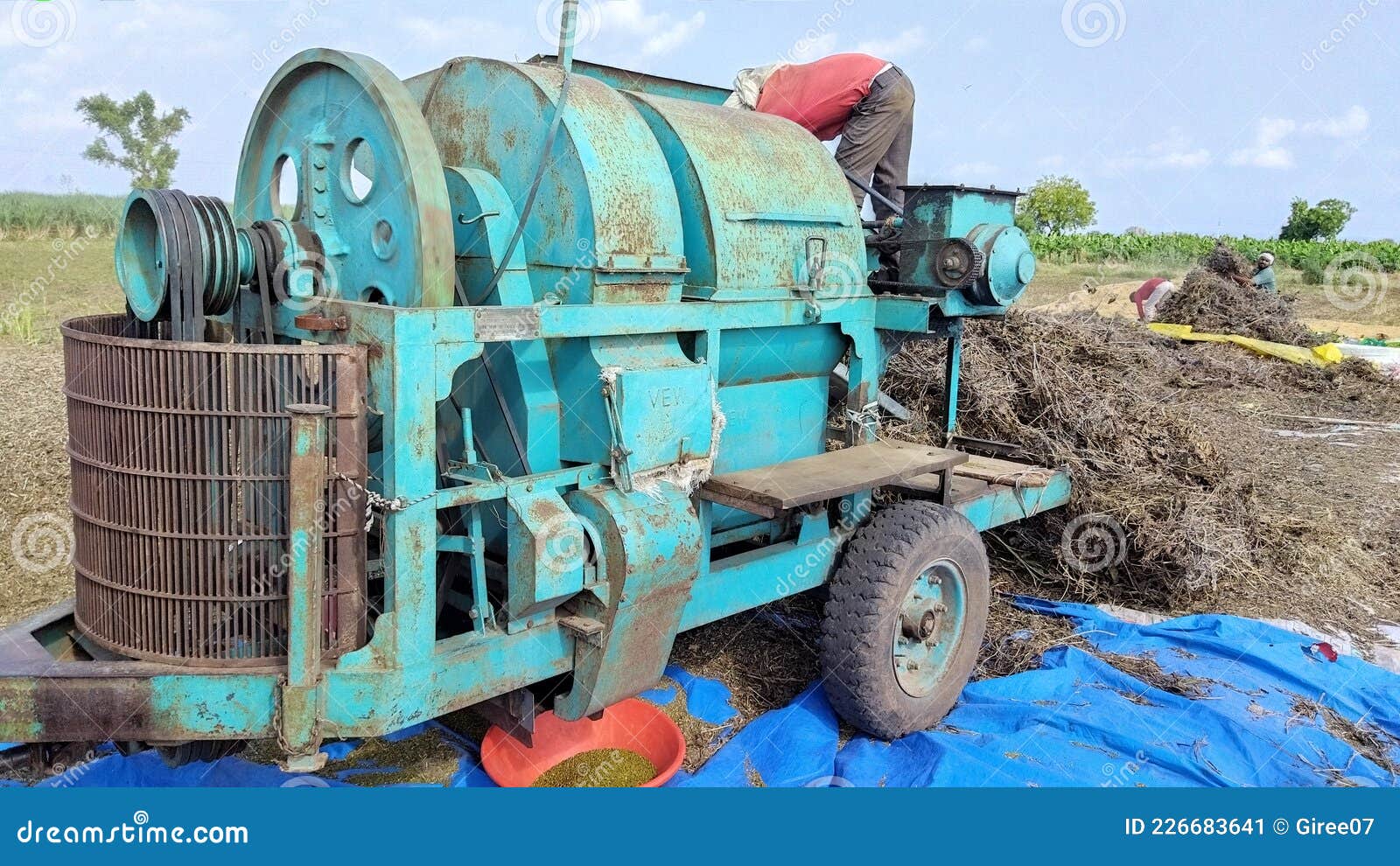 Thresher Machine Operator Cleaning To Machine. Stock Image - Image of ...