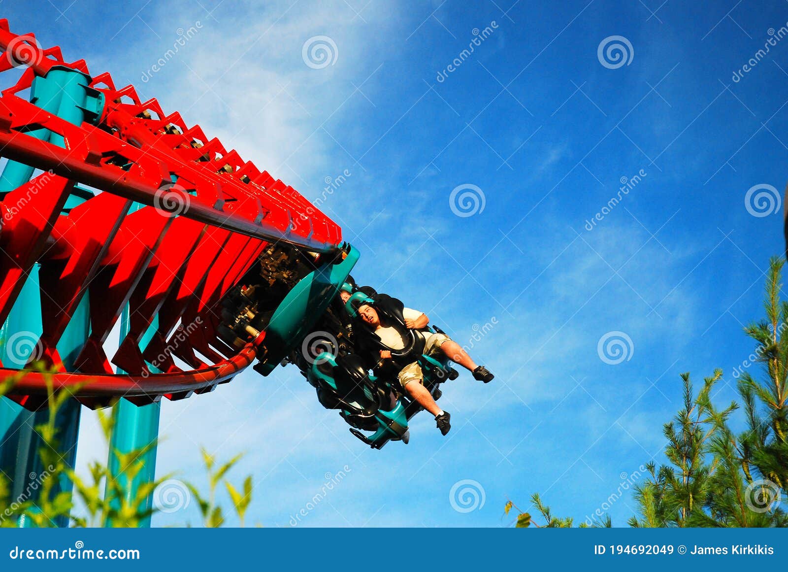 Thrill Riders Zoom Along on a Suspended Roller Coaster Editorial Stock ...