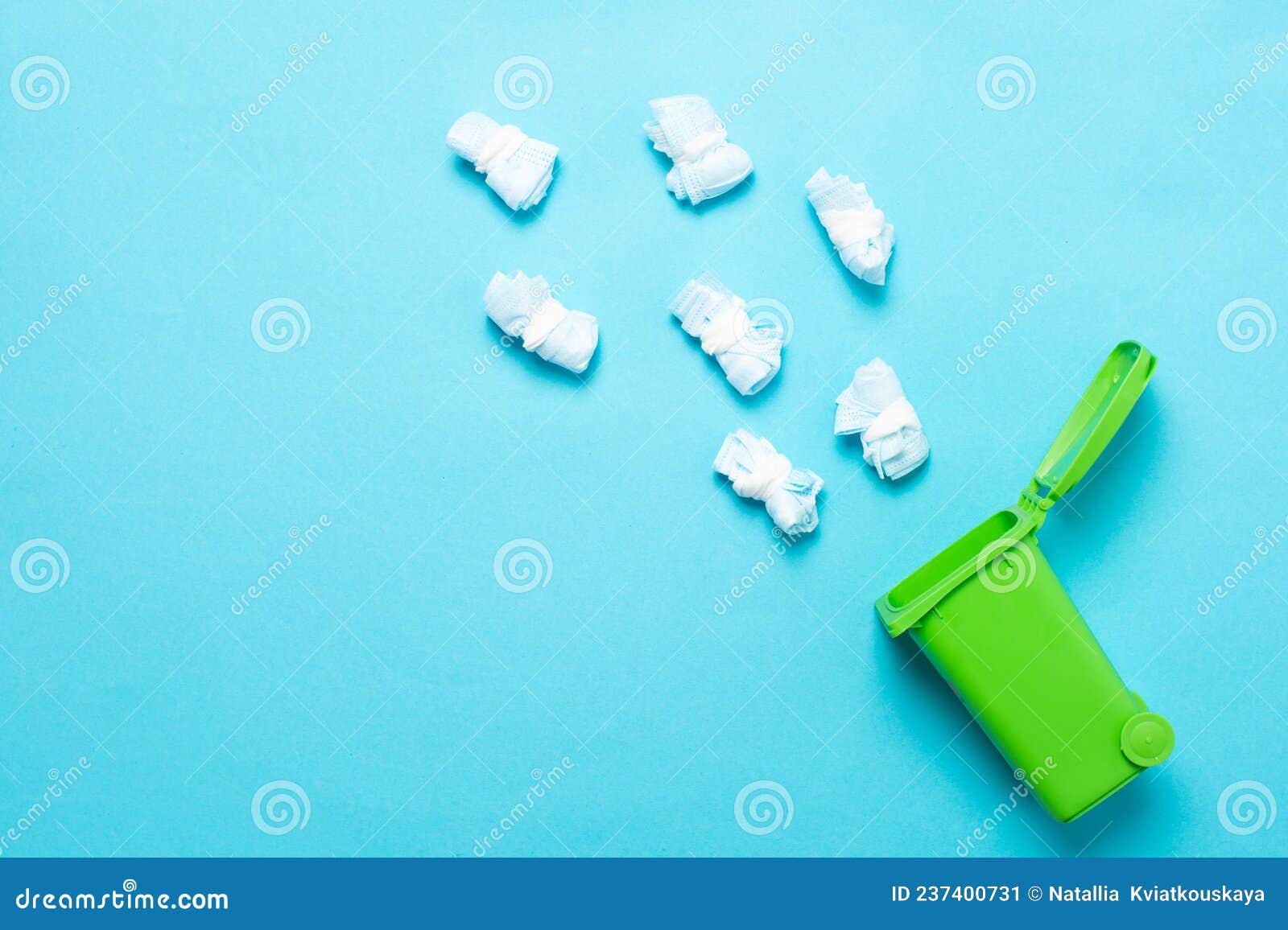 Throw Away Folded Medical Masks in a Green Container for Recycling on a ...