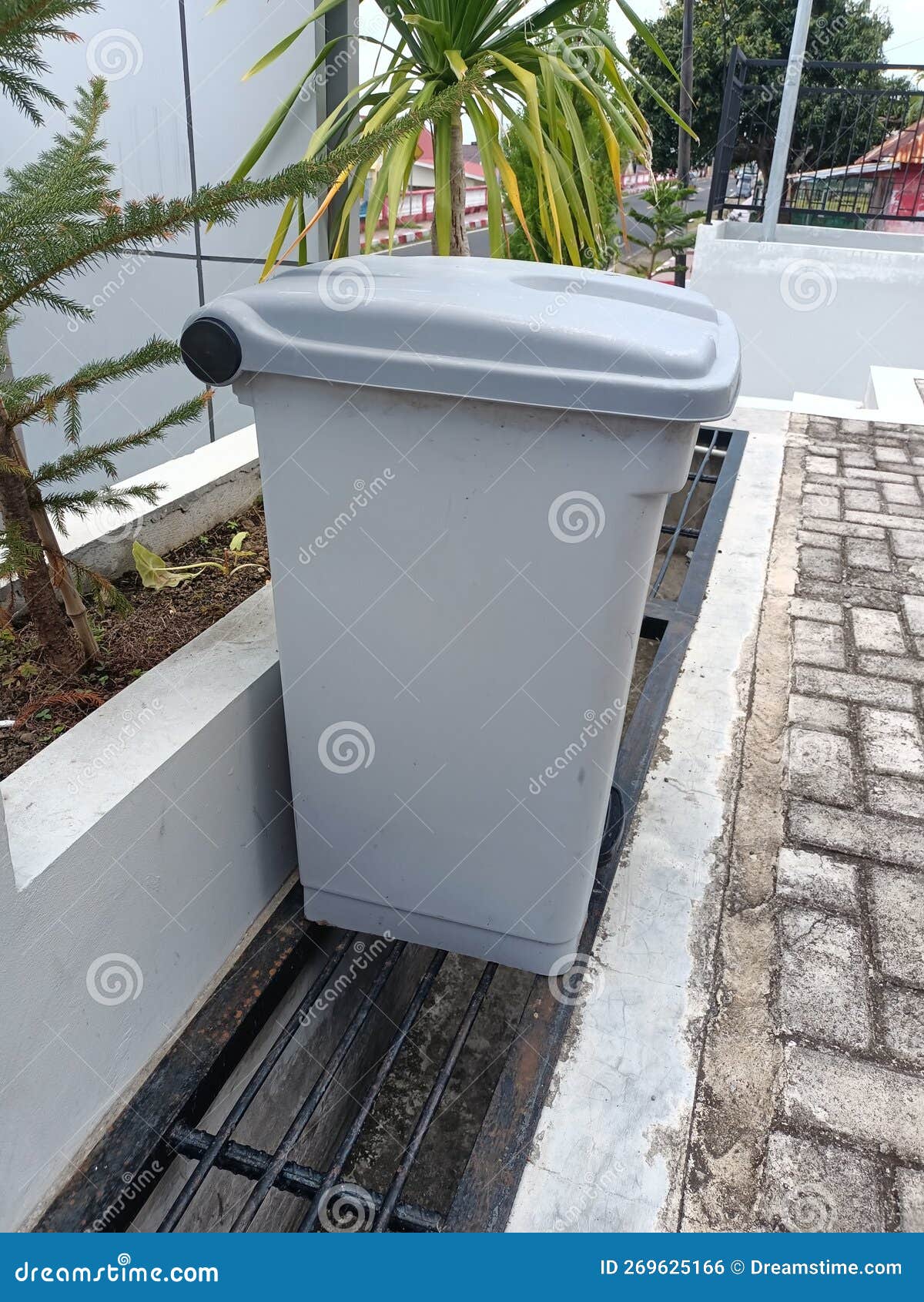 Throw garbage in its place stock photo. Image of house - 269625166
